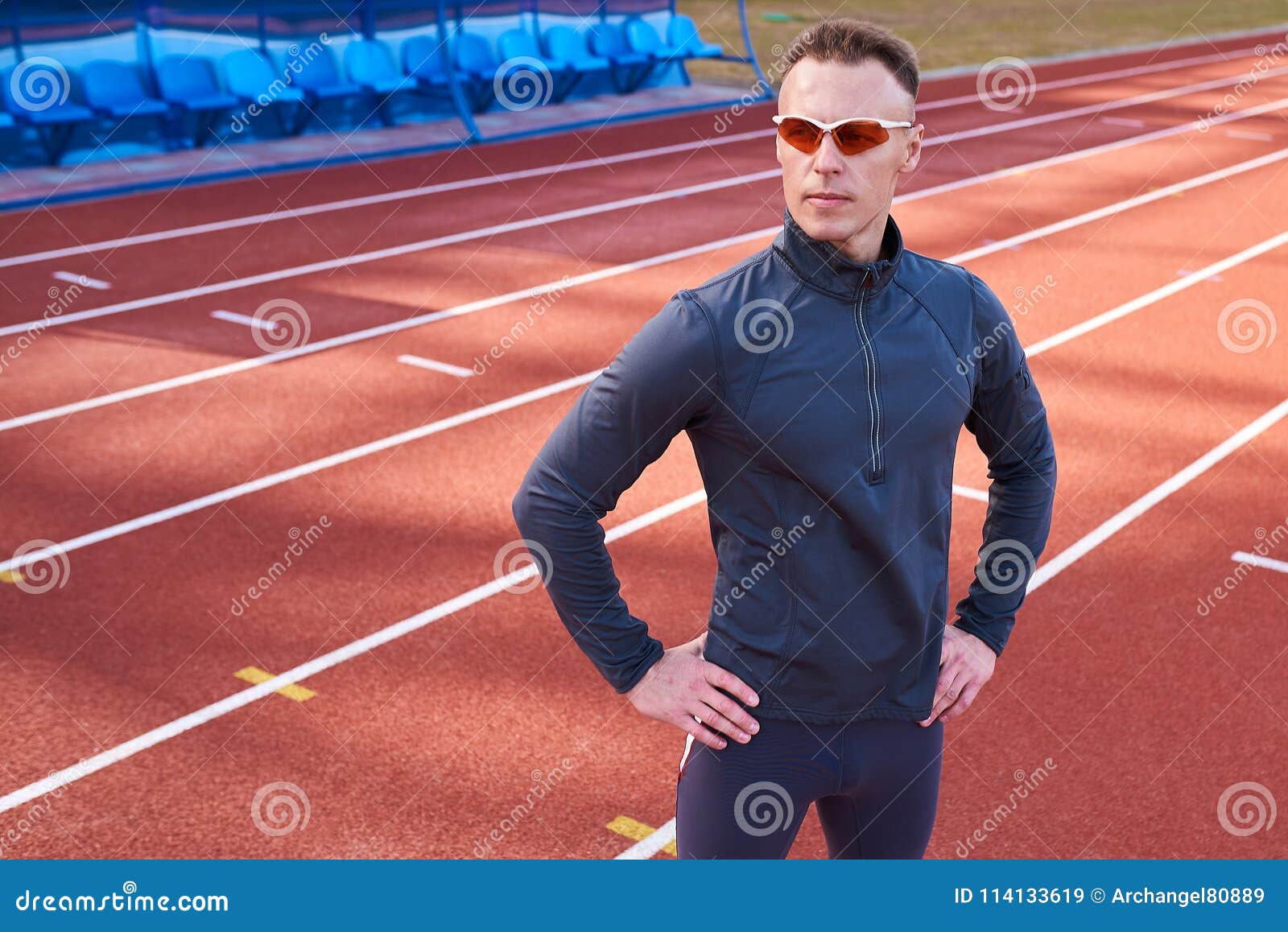 Handsome Athletic Man Posing on the Running Track of the Stadium Stock ...