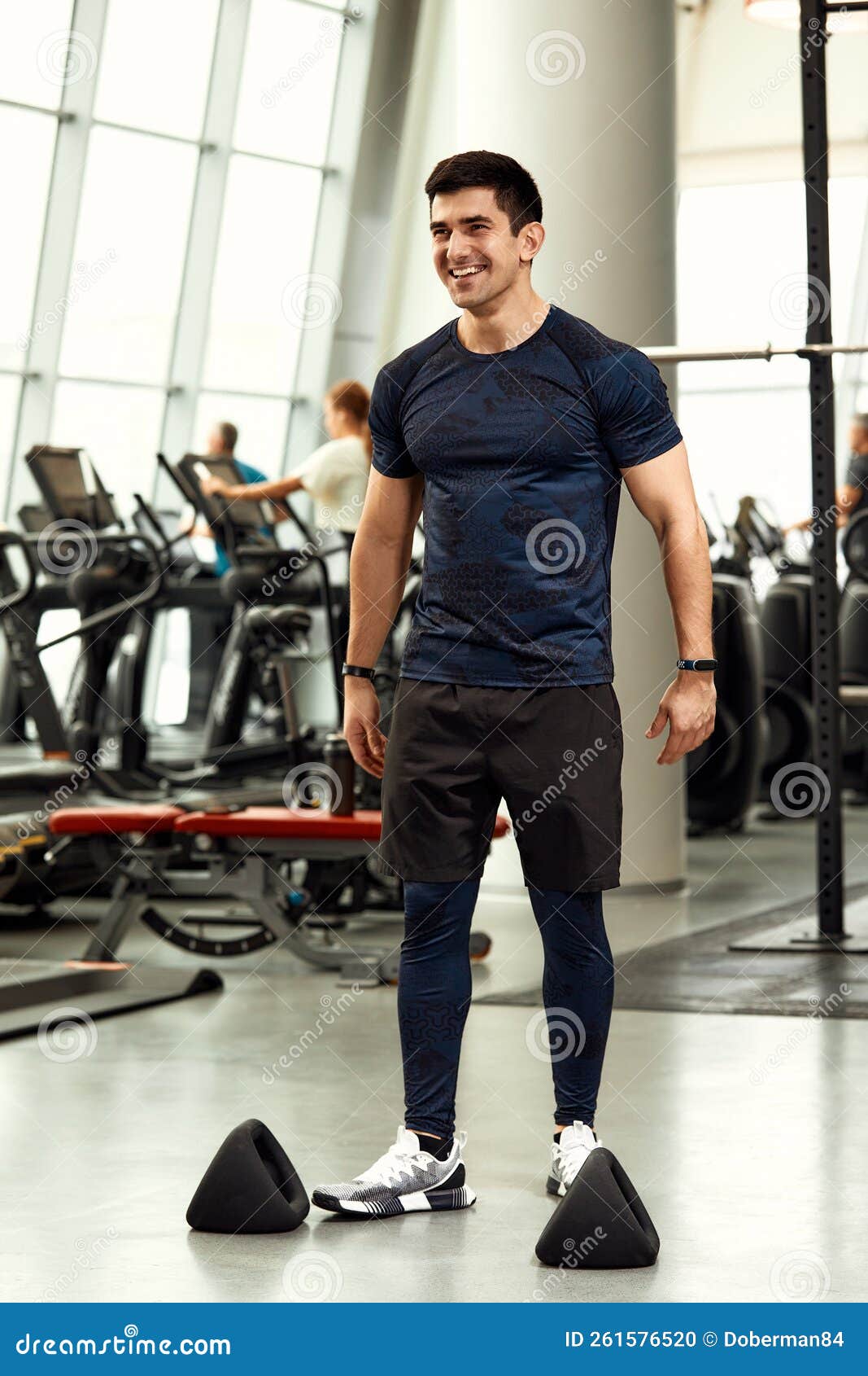 Handsome Athletic Men Exercising with Kettlebell in the Gym Stock Photo ...