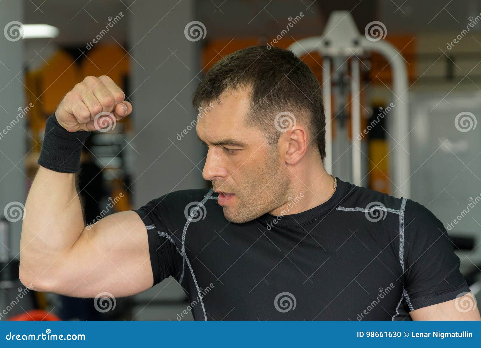 Handsome Athletic Young Man Showing His Biceps Posing in Gym Stock ...