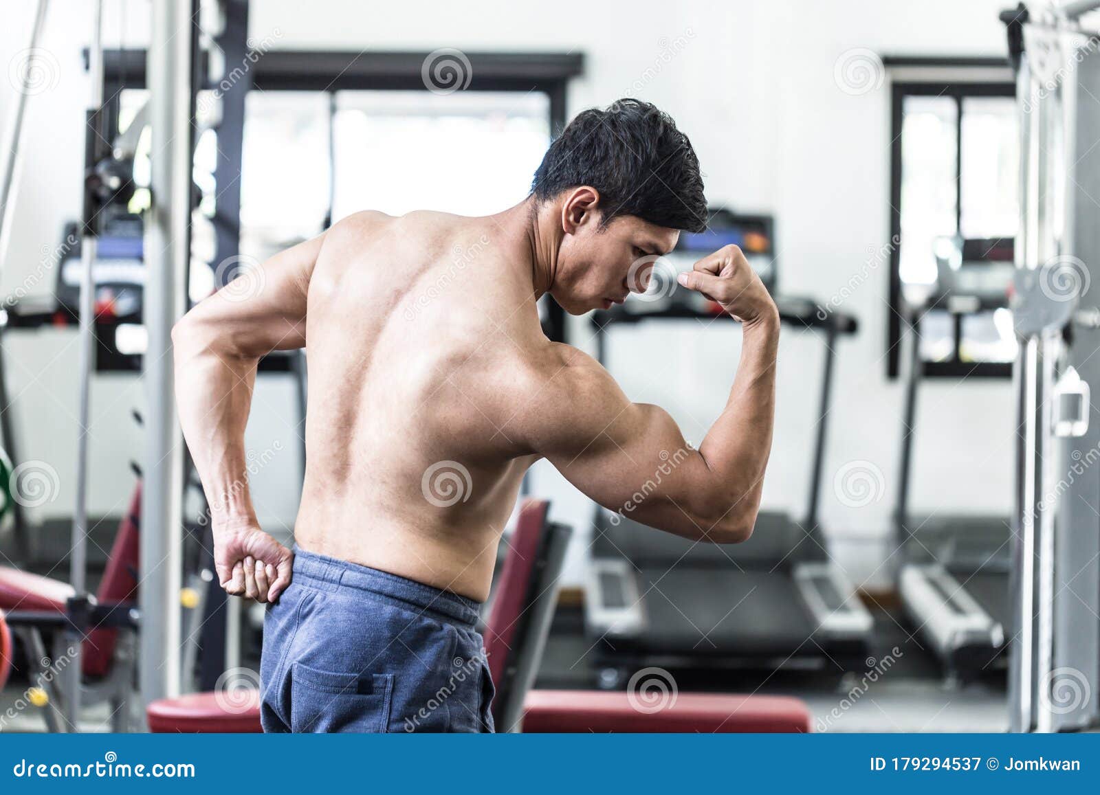 Handsome Attractive Asian Men Doing Bodybuilder Side Biceps Pose in Gym ...