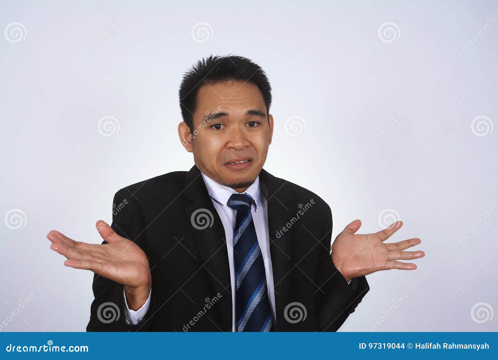 A Handsome Attractive Young Asian Businessman with I Don`t Know Gesture ... A Handsome Attractive Young Asian Businessman with I Don`t Know Gesture ...