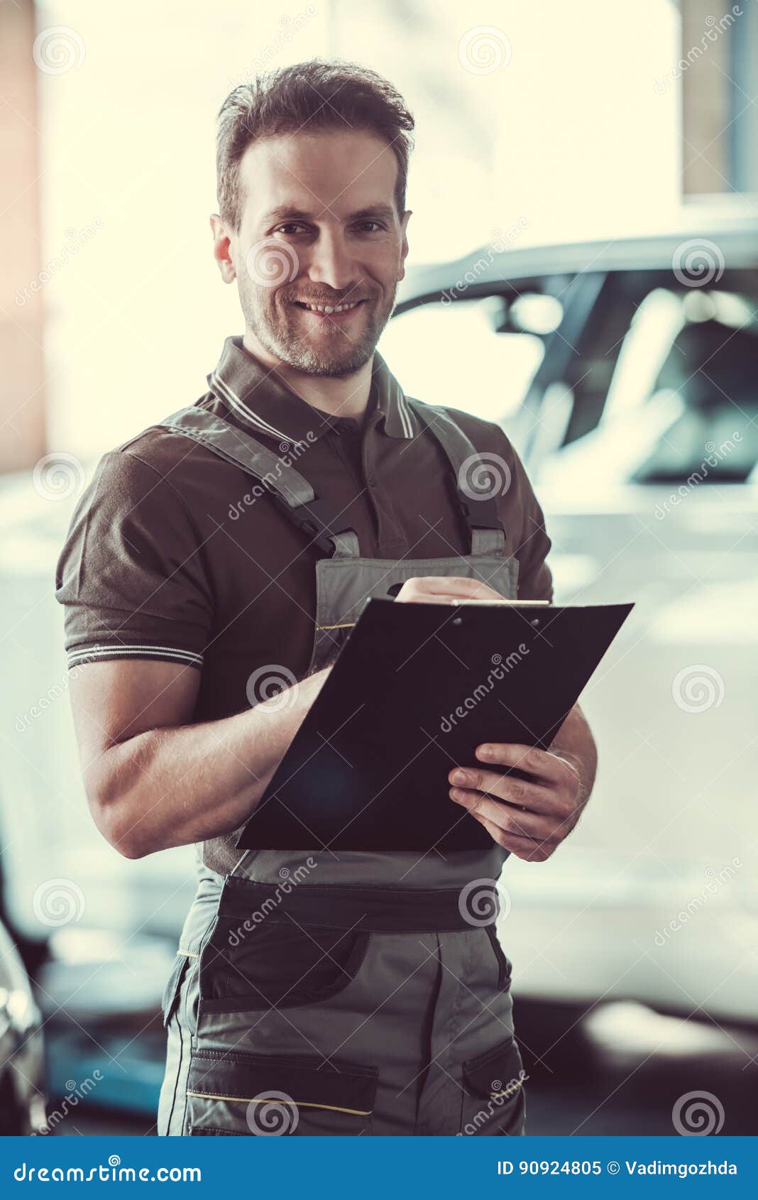 Handsome Auto Service Worker Stock Image - Image of caucasian, notes ...