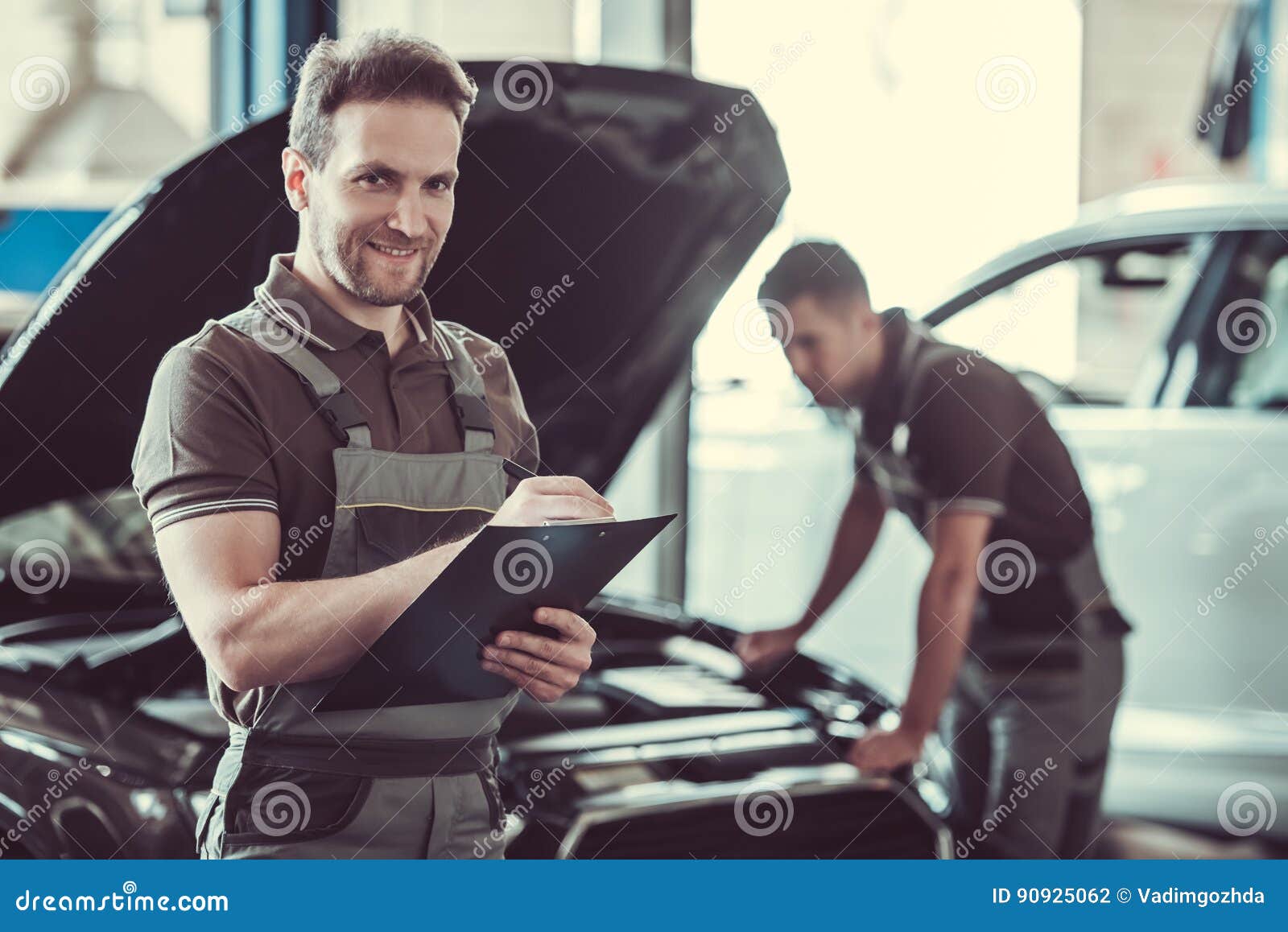Handsome Auto Service Workers Stock Photo - Image of brake, automobile ...