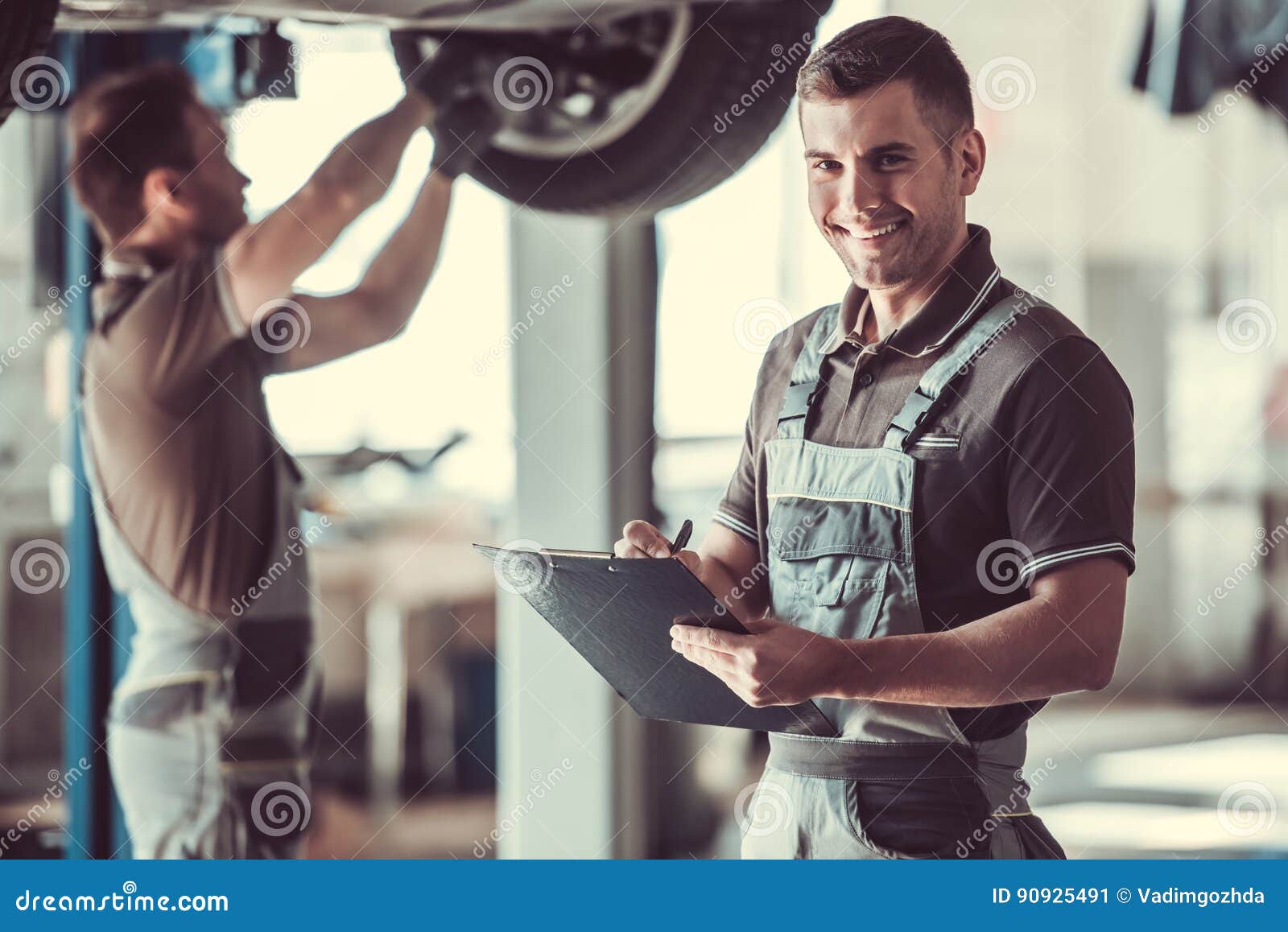 Handsome Auto Service Workers Stock Image - Image of shop, safety: 90925491