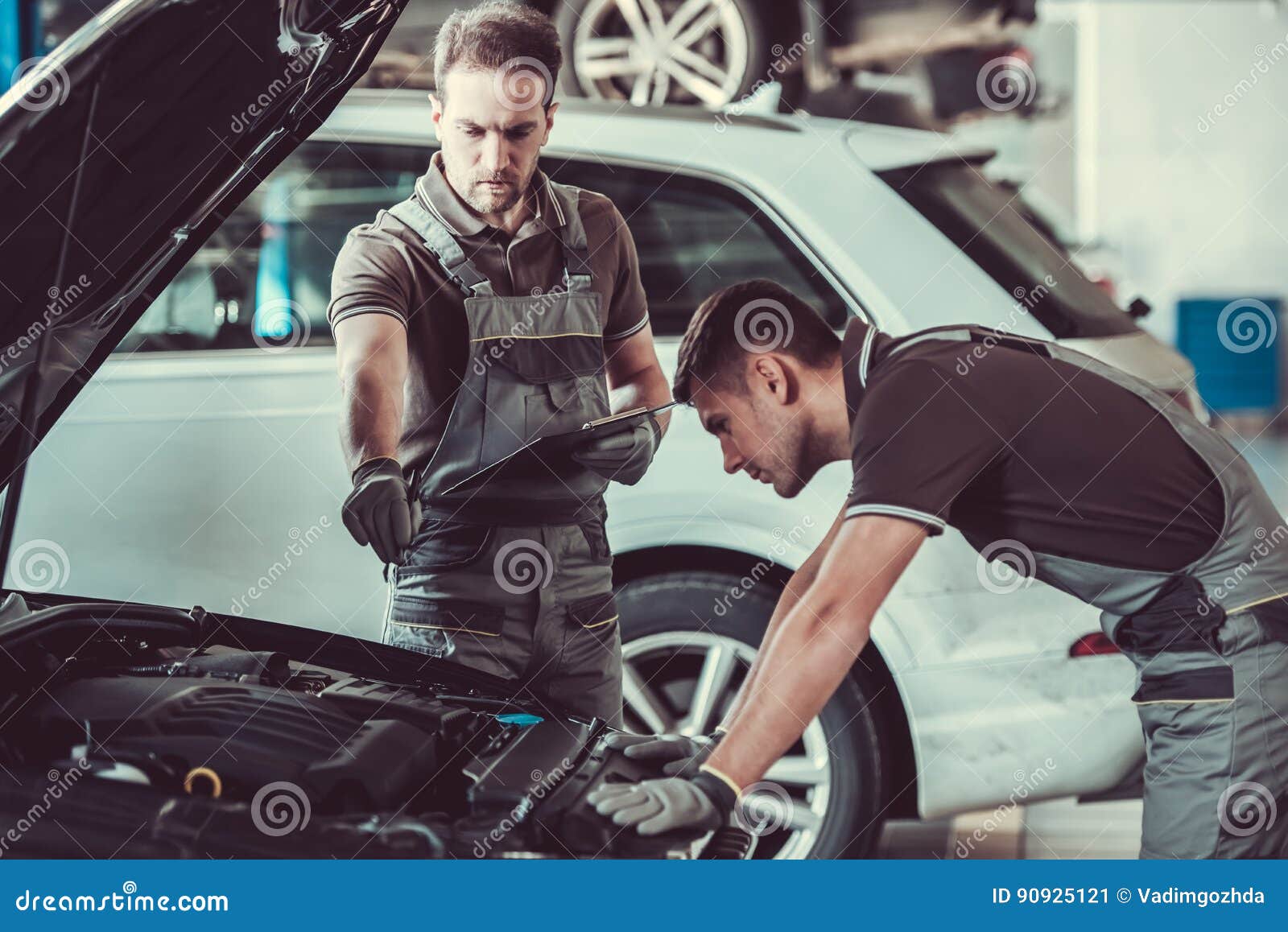Handsome Auto Service Workers Stock Image - Image of automotive ...