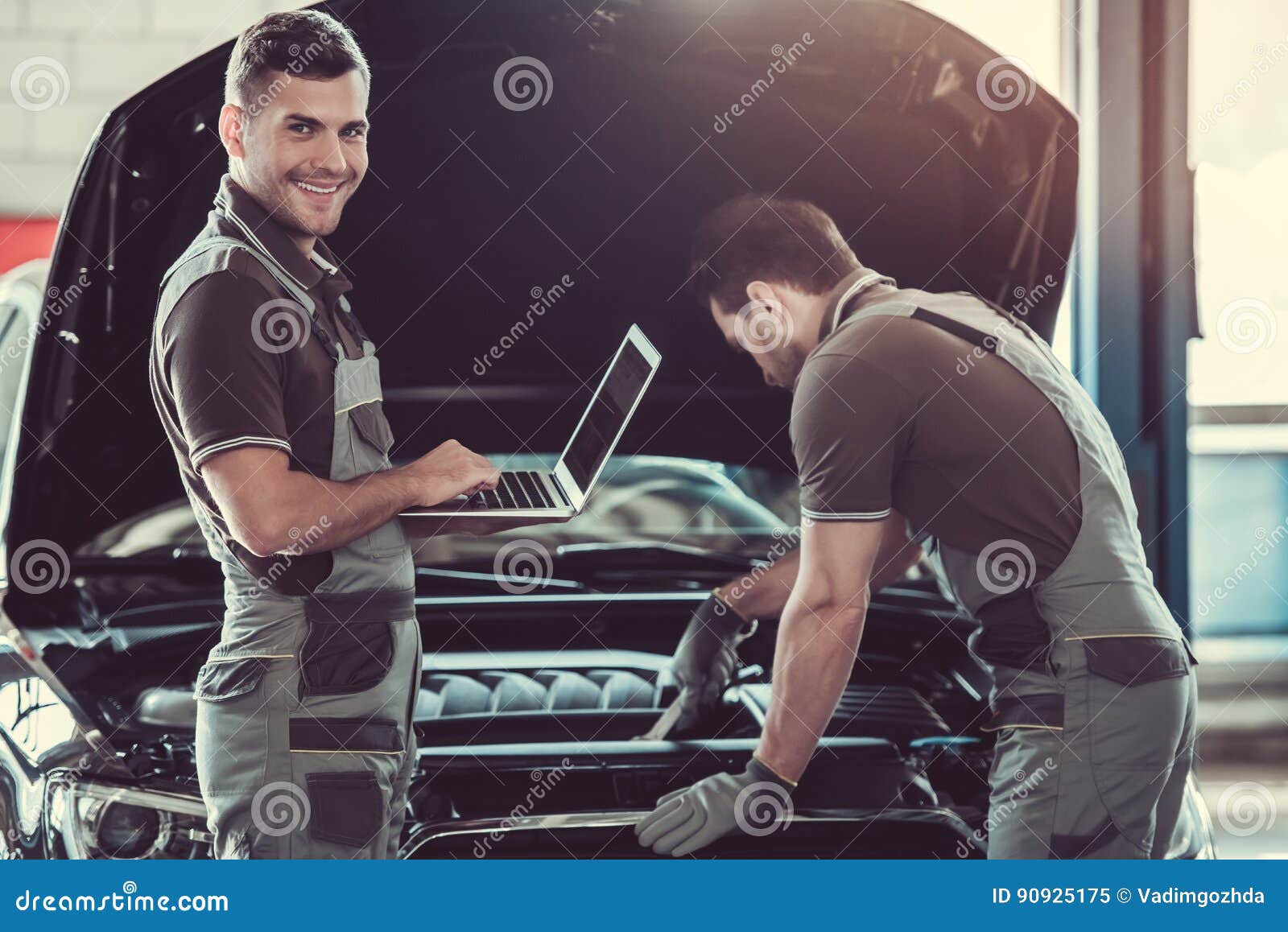 Handsome Auto Service Workers Stock Image - Image of safety, labor ...