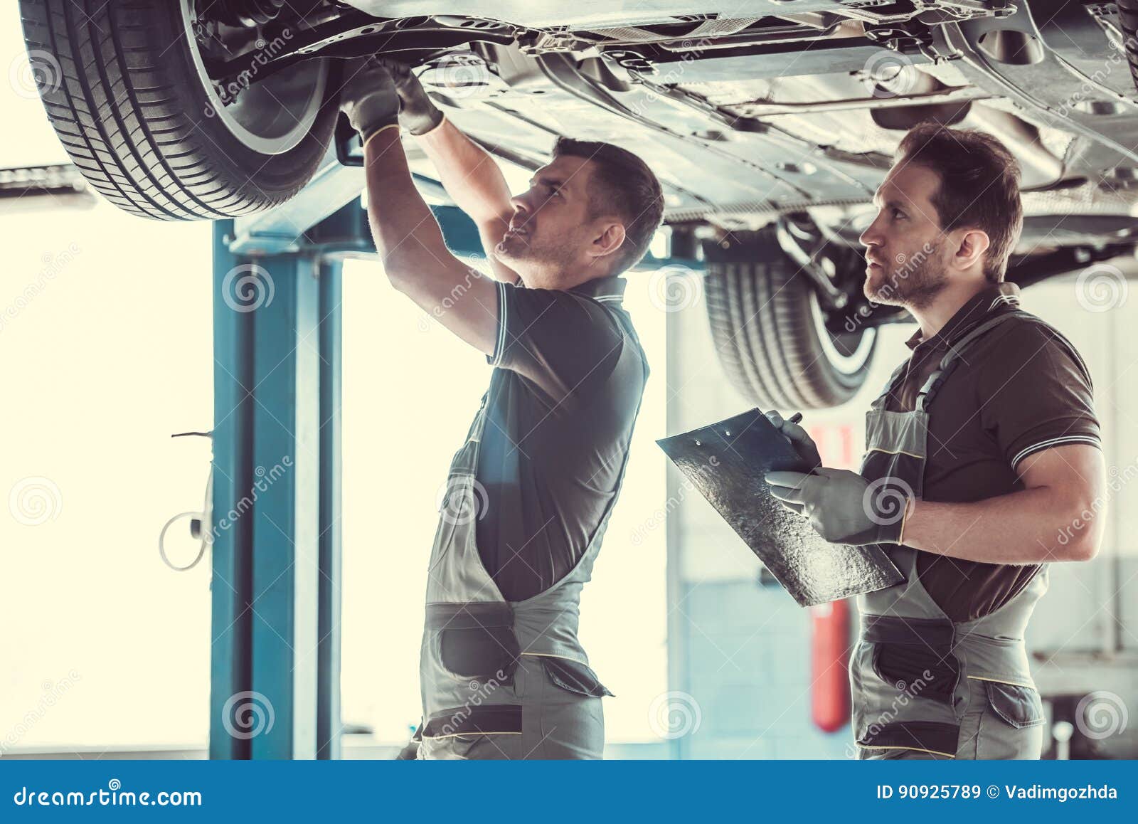 Handsome Auto Service Workers Stock Image - Image of assistant, repair ...