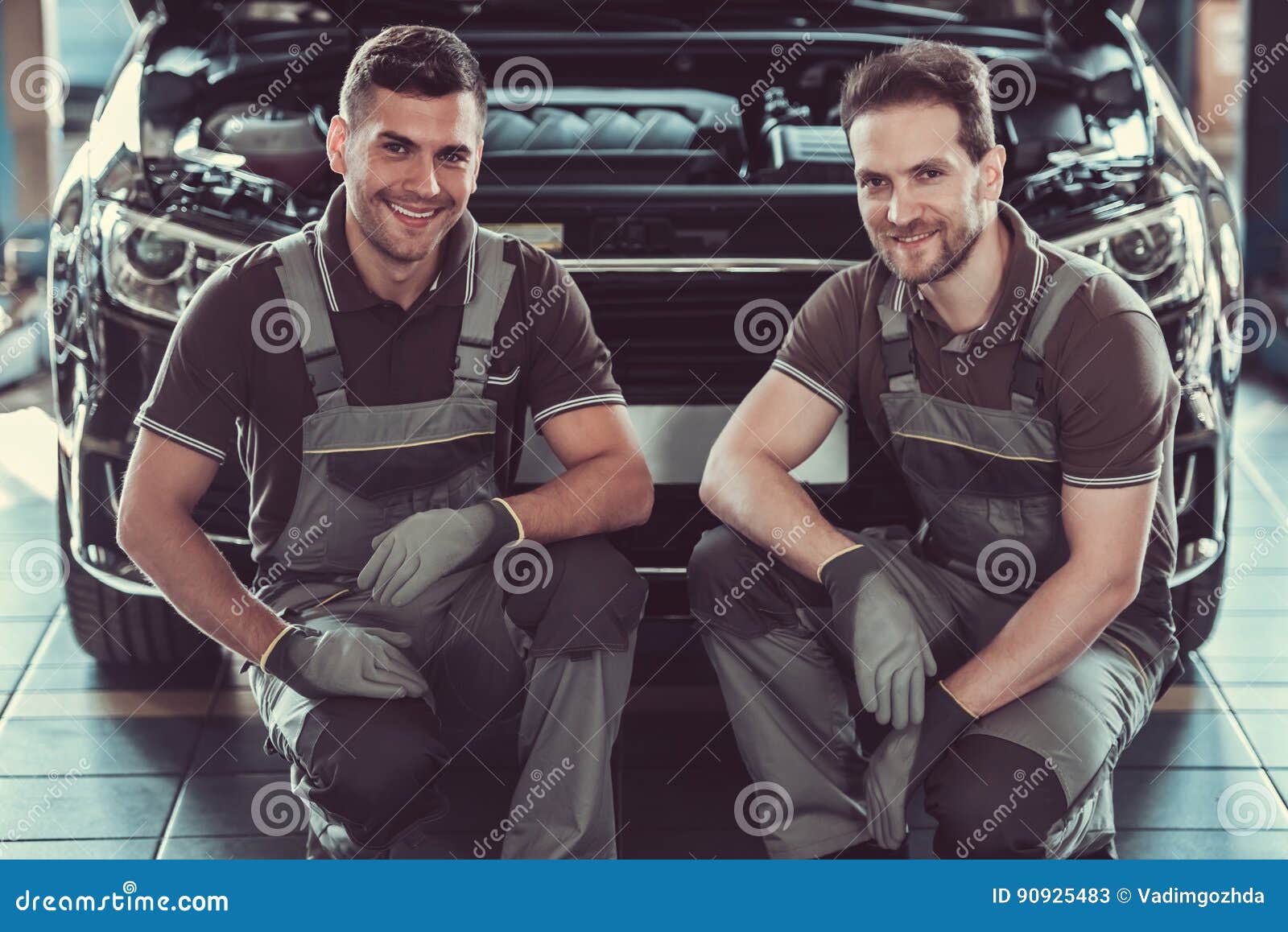 Handsome Auto Service Workers Stock Image - Image of station, team ...