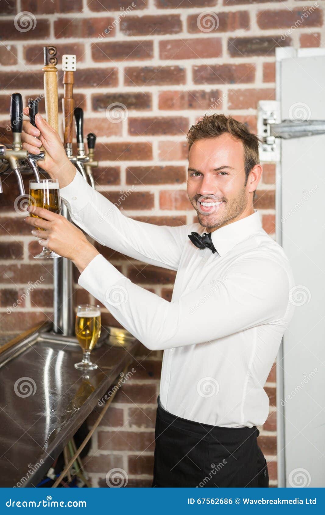 Handsome Bar Tender Pouring a Pint Stock Photo - Image of beer ...