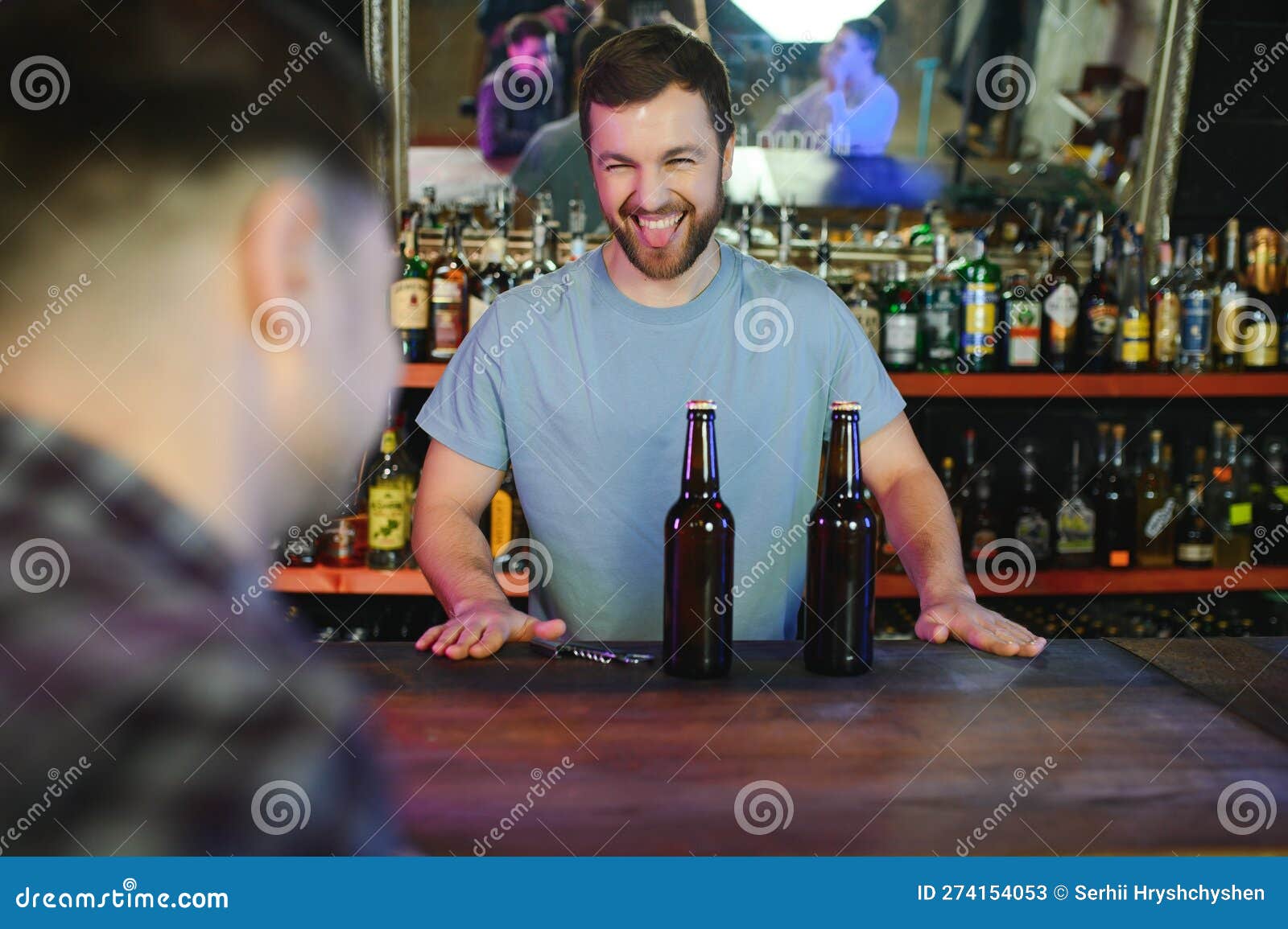 Handsome Bar Tender Standing Behind His Counter in a Pub Stock Image ...