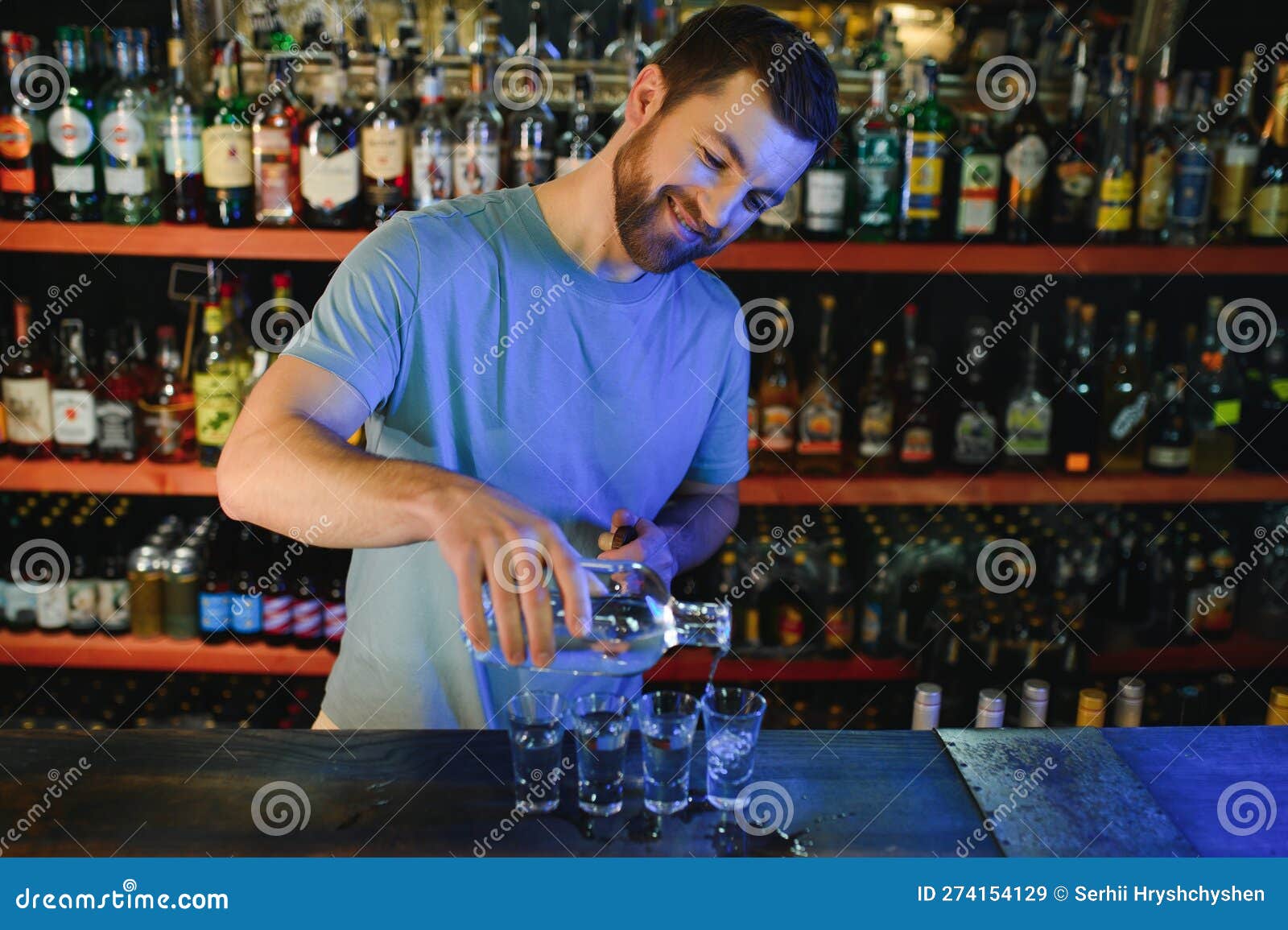Handsome Bar Tender Standing Behind His Counter in a Pub Stock Image ...