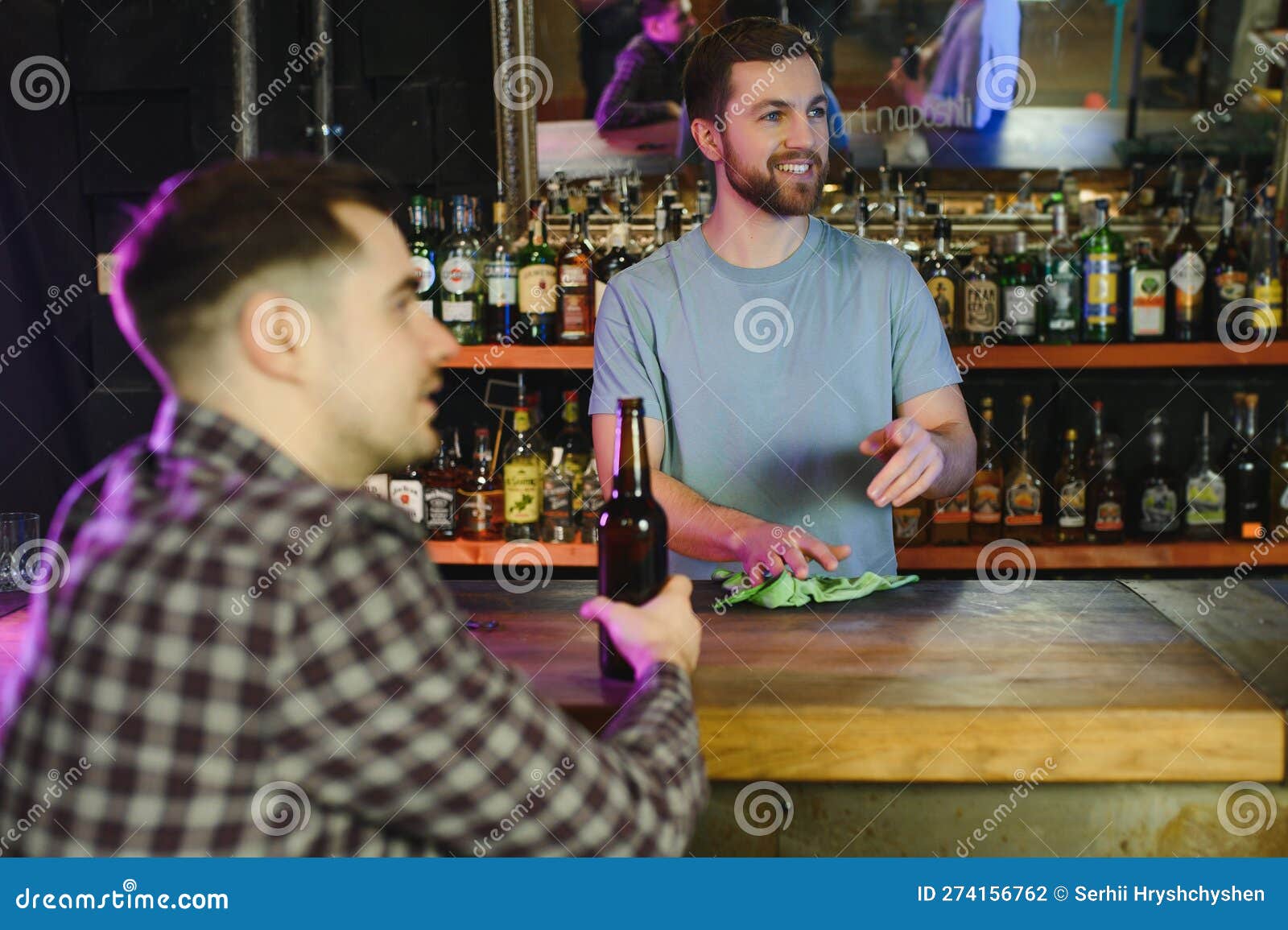Handsome Bar Tender Standing Behind His Counter in a Pub Stock Photo ...