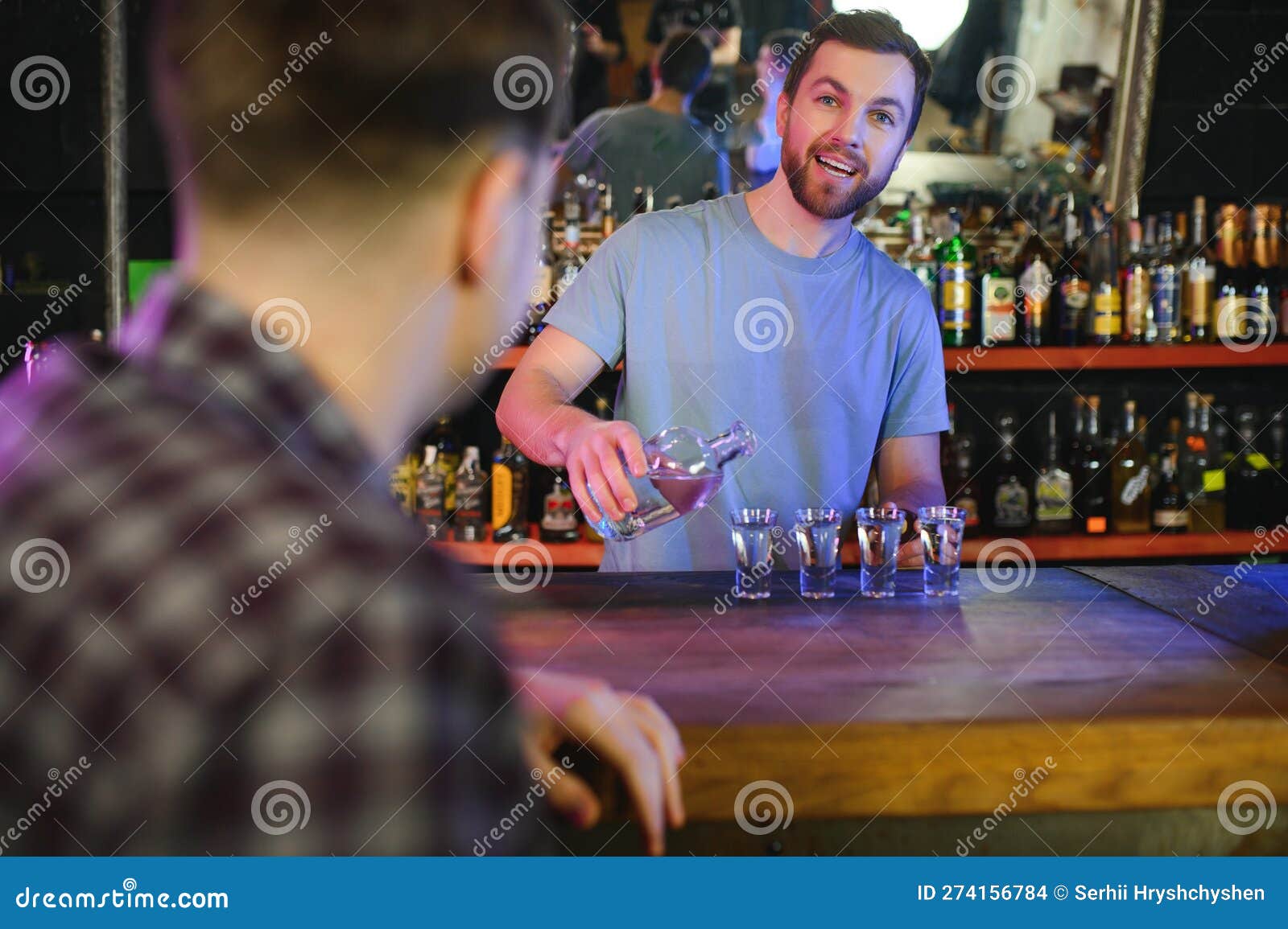 Handsome Bar Tender Standing Behind His Counter in a Pub Stock Photo ...