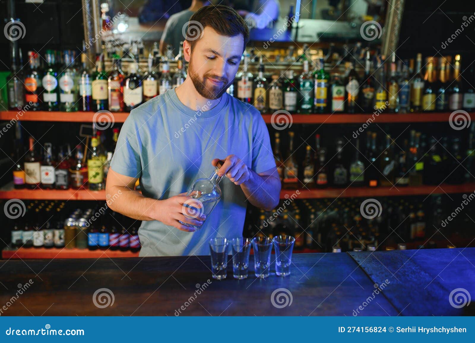 Handsome Bar Tender Standing Behind His Counter in a Pub Stock Photo ...