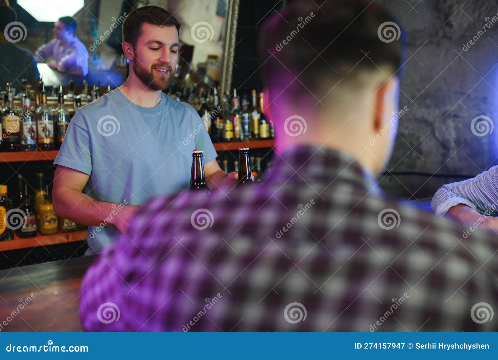 Handsome Bar Tender Standing Behind His Counter in a Pub Stock Image ...