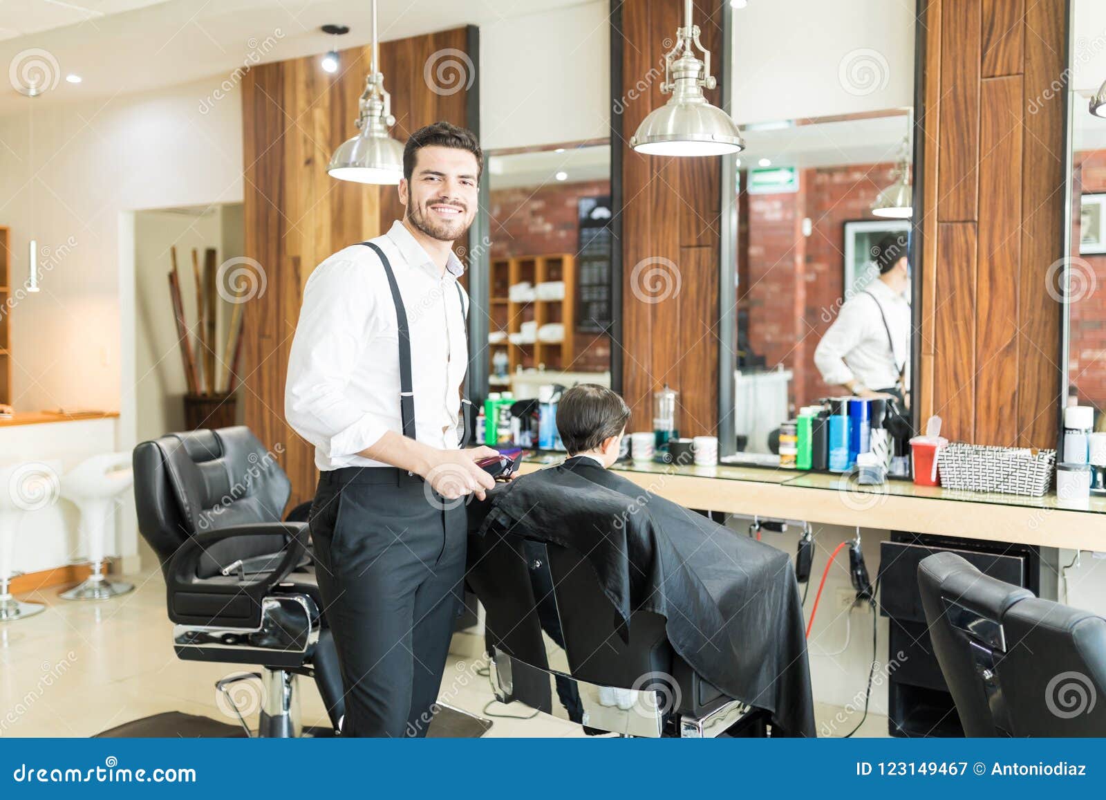 Barber Smiling while Hair Styling Customer in Shop Stock Image - Image ... Barber Smiling while Hair Styling Customer in Shop Stock Image - Image ...