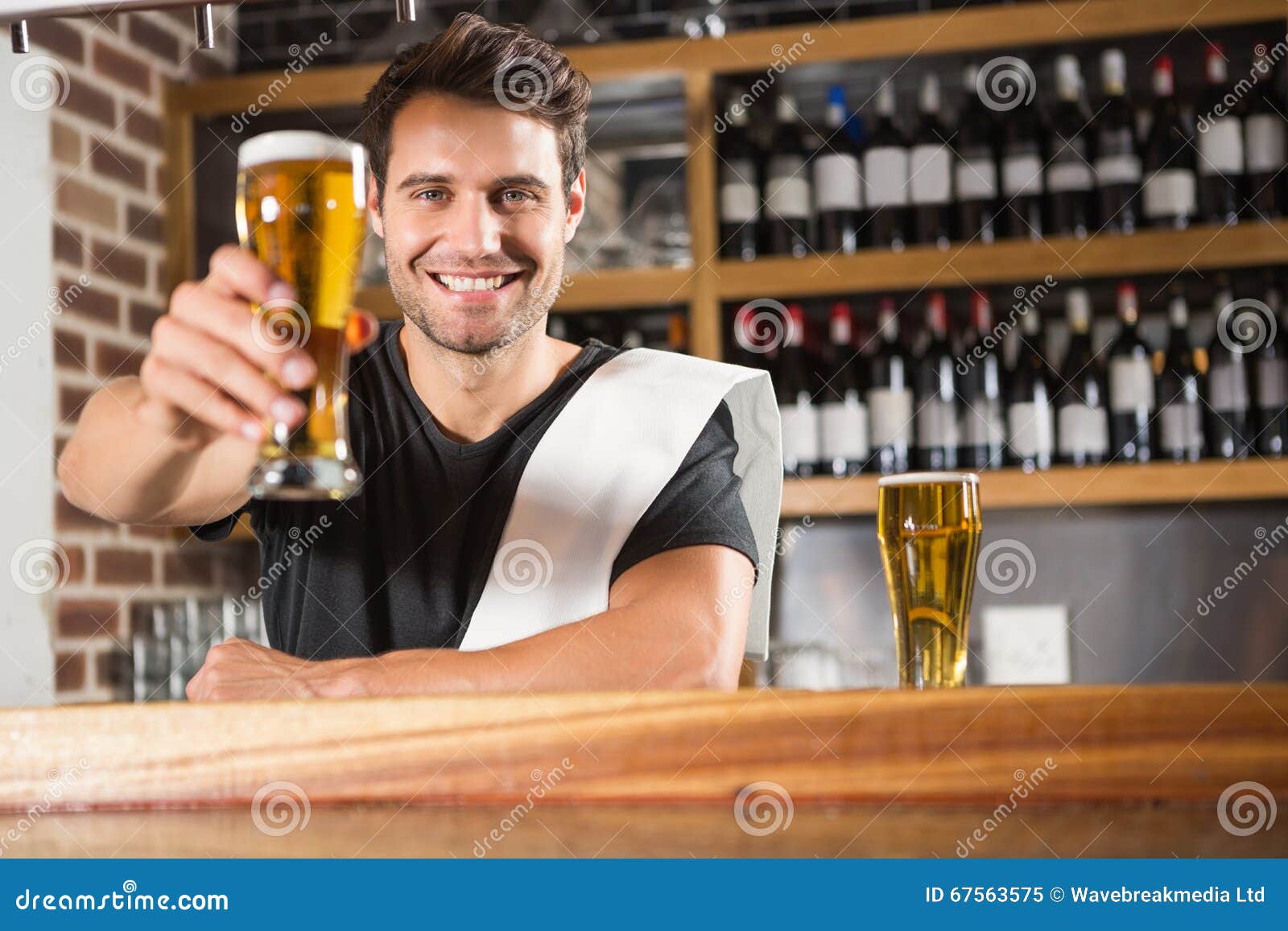Handsome Barman Holding a Pint of Beer Stock Image - Image of drink ...