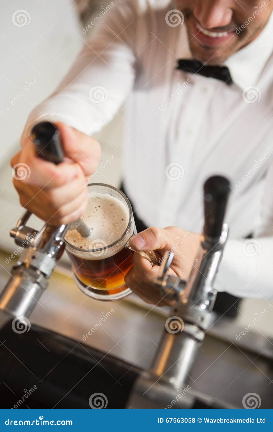 Handsome Barman Pouring a Pint of Beer Stock Photo - Image of happy ...