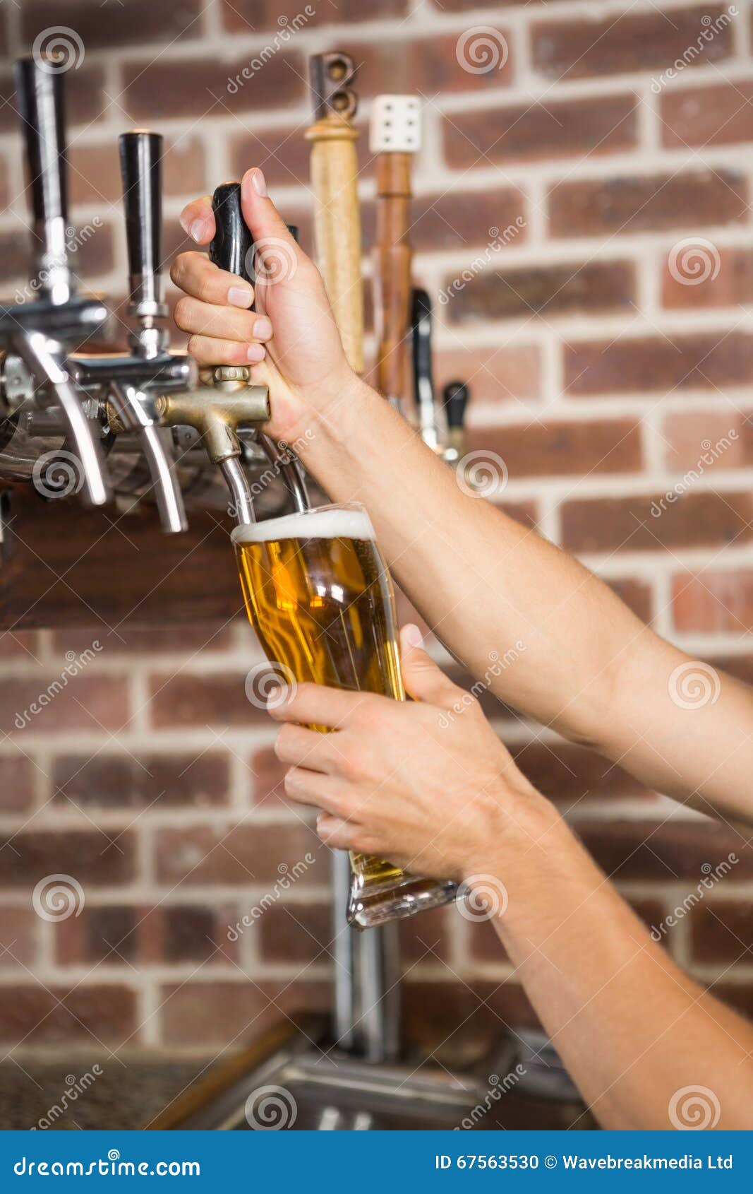 Handsome Barman Pouring a Pint of Beer Stock Photo - Image of adult ...