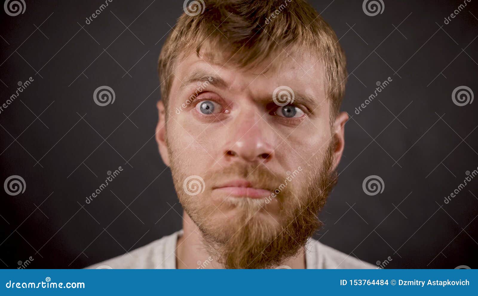 Handsome Bearded Hipster Male Express Surprise in the Black Studio ...