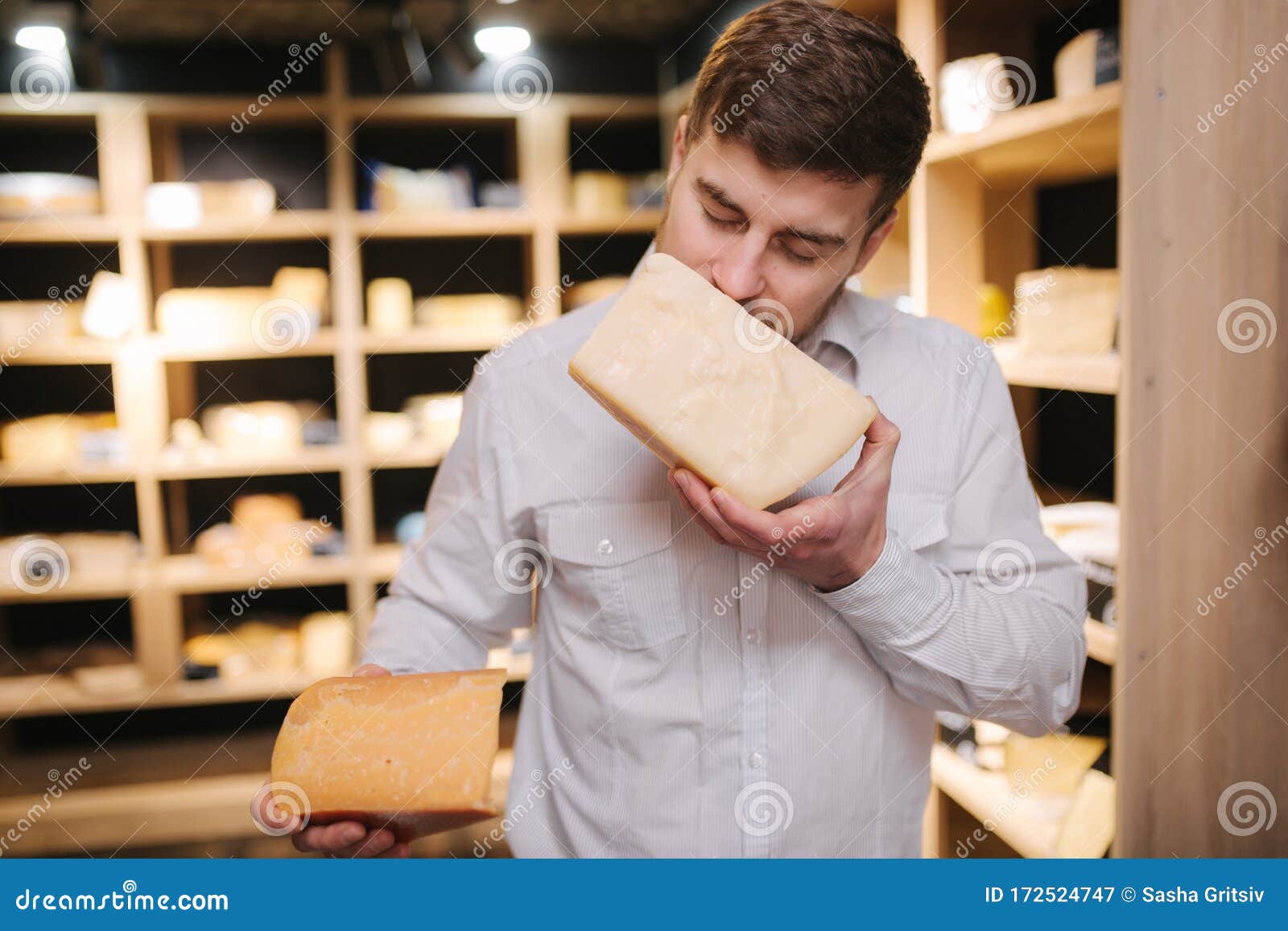 Handsome Bearded Man Hold Different Types of Aged Cheese in Hands at ...