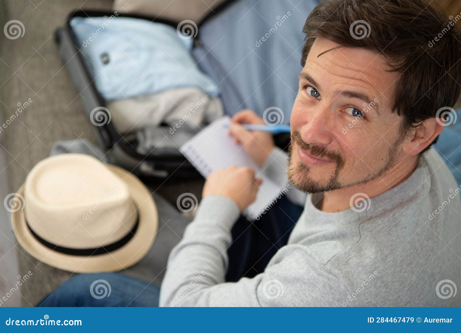 Handsome Bearded Smiling Man Packing Stuff Holding Check List Stock ...