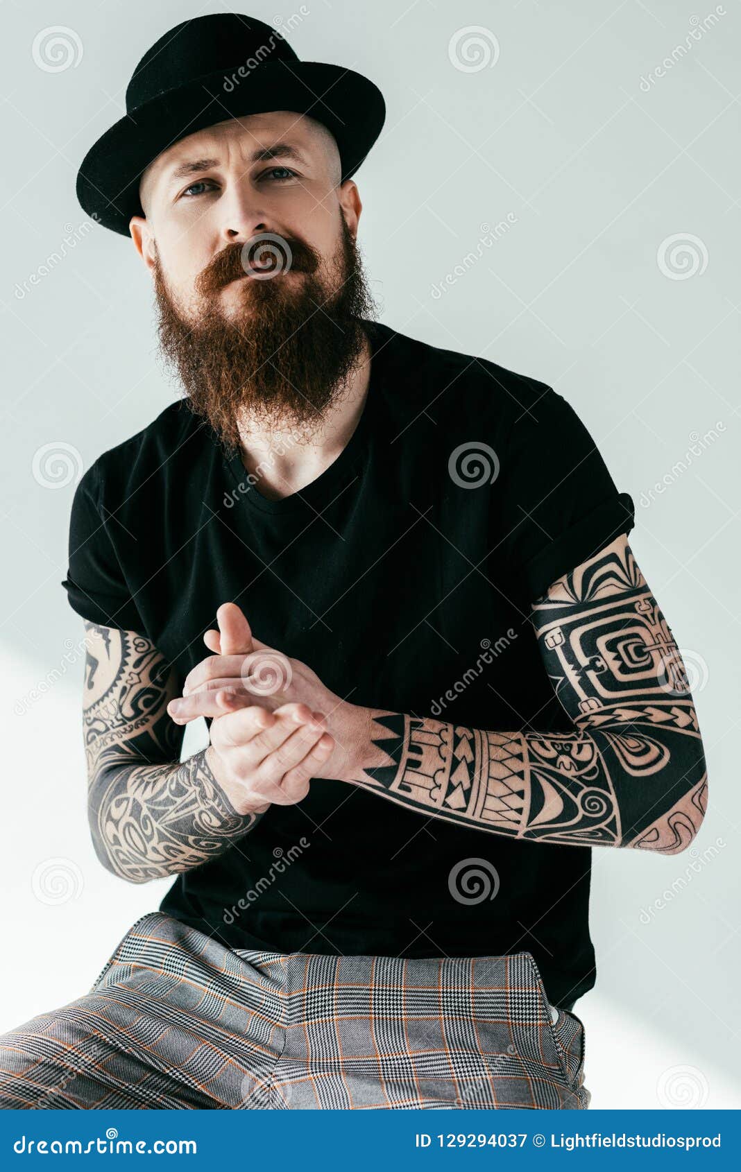 Handsome Bearded Tattooed Man in Hat Looking at Camera Stock Image ...