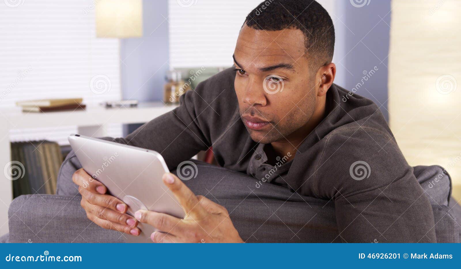 Handsome Black Guy Using Tablet Stock Image - Image of smiling, sitting ...