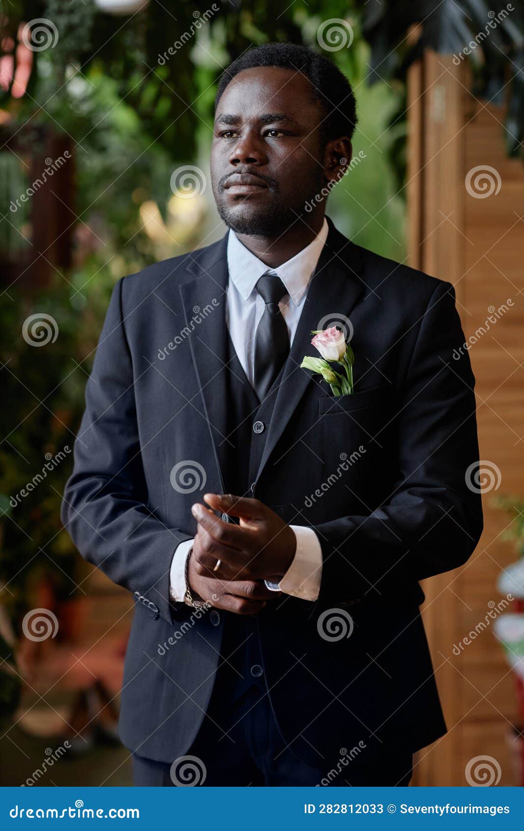 Handsome Black Man Getting Ready for Wedding Ceremony and Adjusting Tux ...