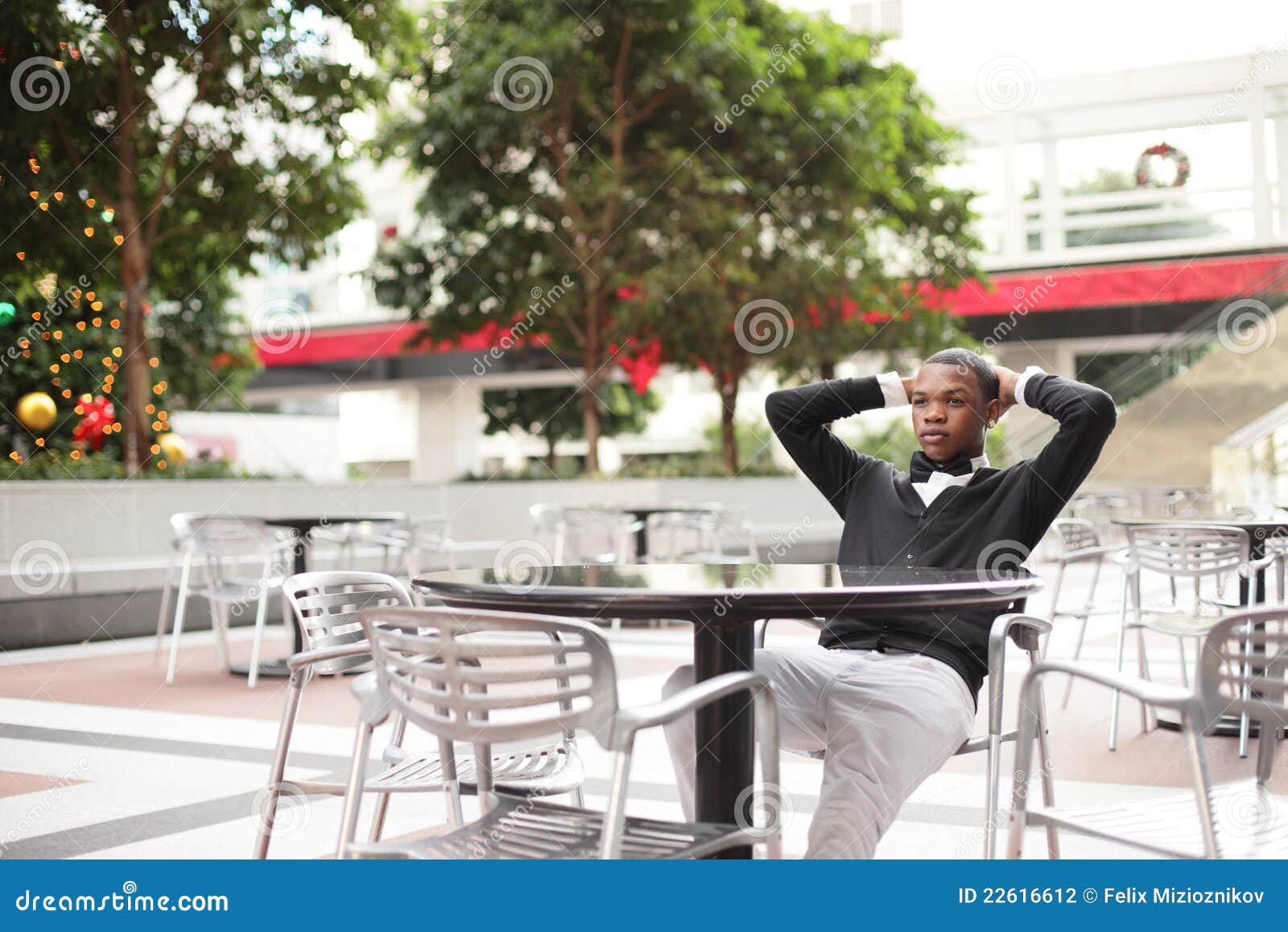 Handsome Black Man Relaxing at a Table Stock Photo - Image of downtown ...