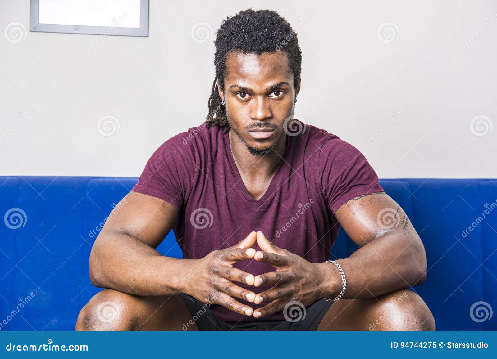 Handsome Black Man Sitting on Couch Stock Image - Image of daylight ...