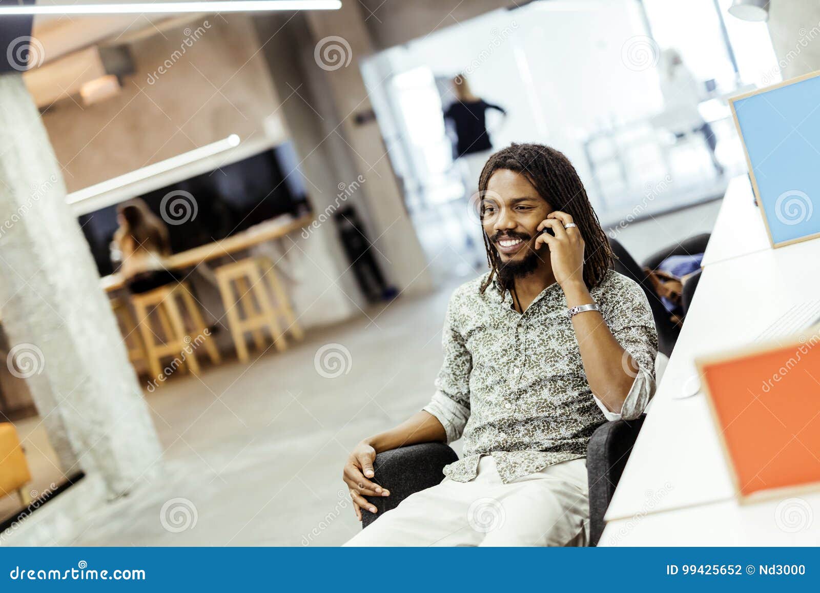 Handsome Black Man Using Phone in Office Stock Photo - Image of company ...