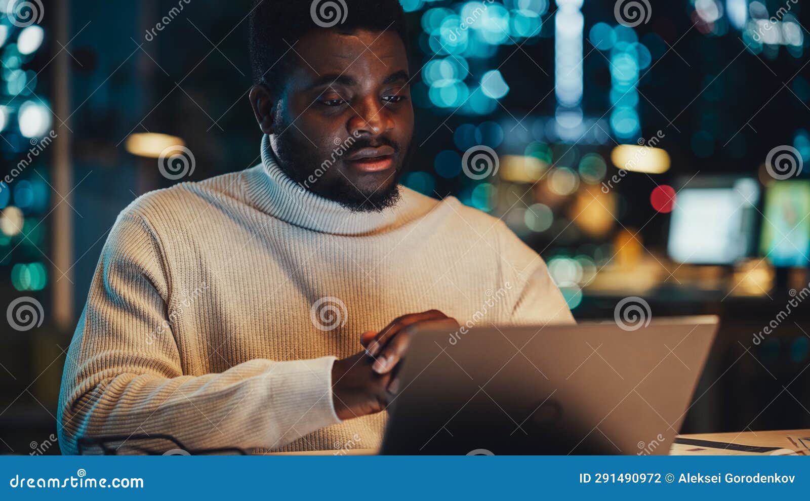 Handsome Black Project Manager Making a Video Call on Laptop Computer ...