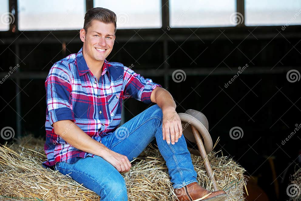 Blond Man in Jeans Sitting on Haystack Stock Photo - Image of country ...