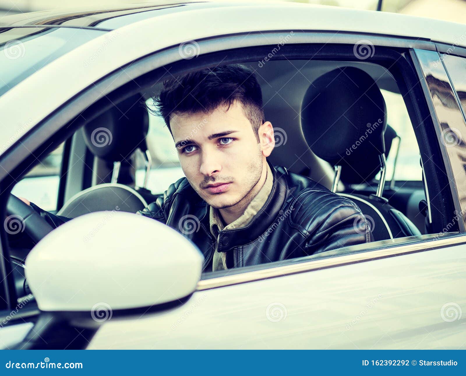 Handsome Blue Eyed Young Man Sitting in His Car Stock Photo - Image of ... Handsome Blue Eyed Young Man Sitting in His Car Stock Photo - Image of ...