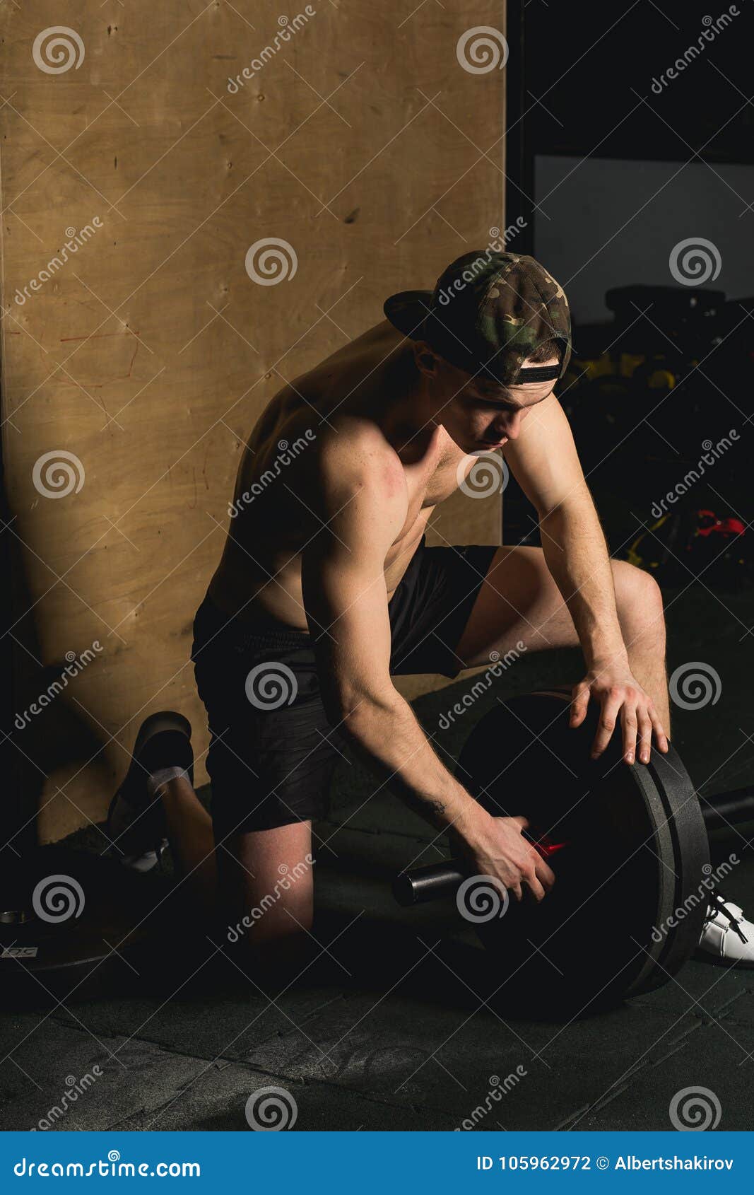 Handsome Weightlifter Preparing for Training with Barbell Stock Photo ...