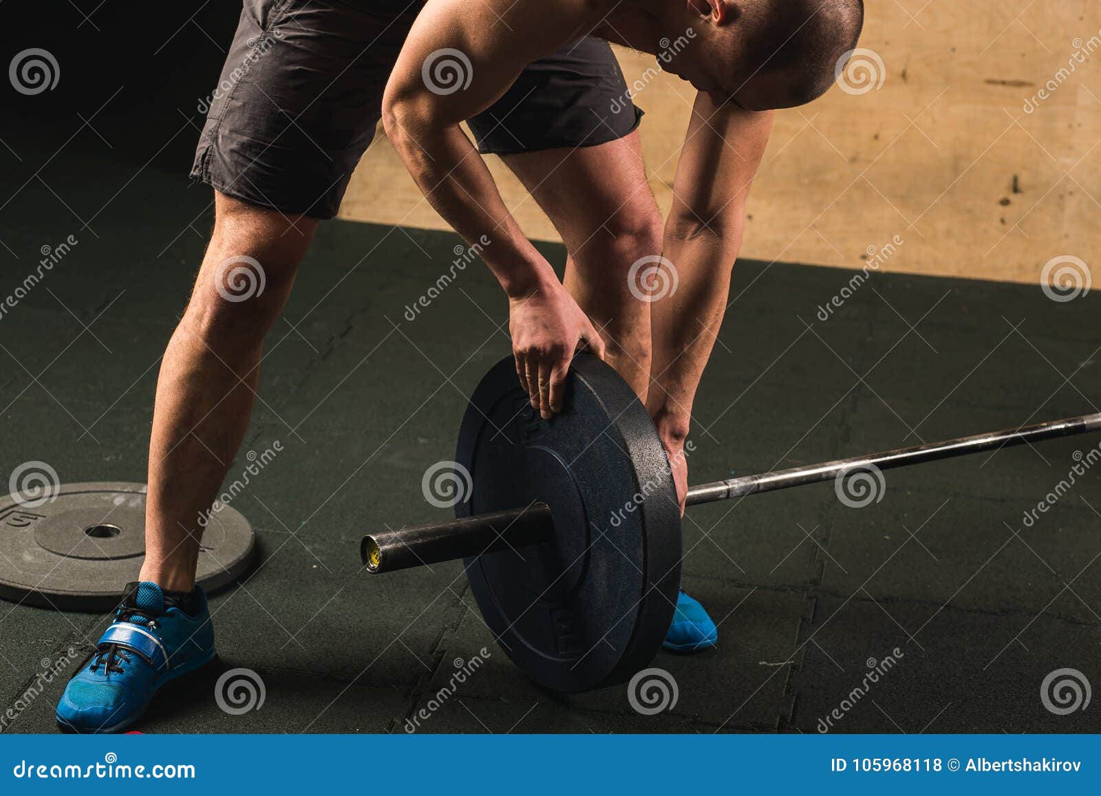 Handsome Weightlifter Preparing for Training with Barbell Stock Photo ...
