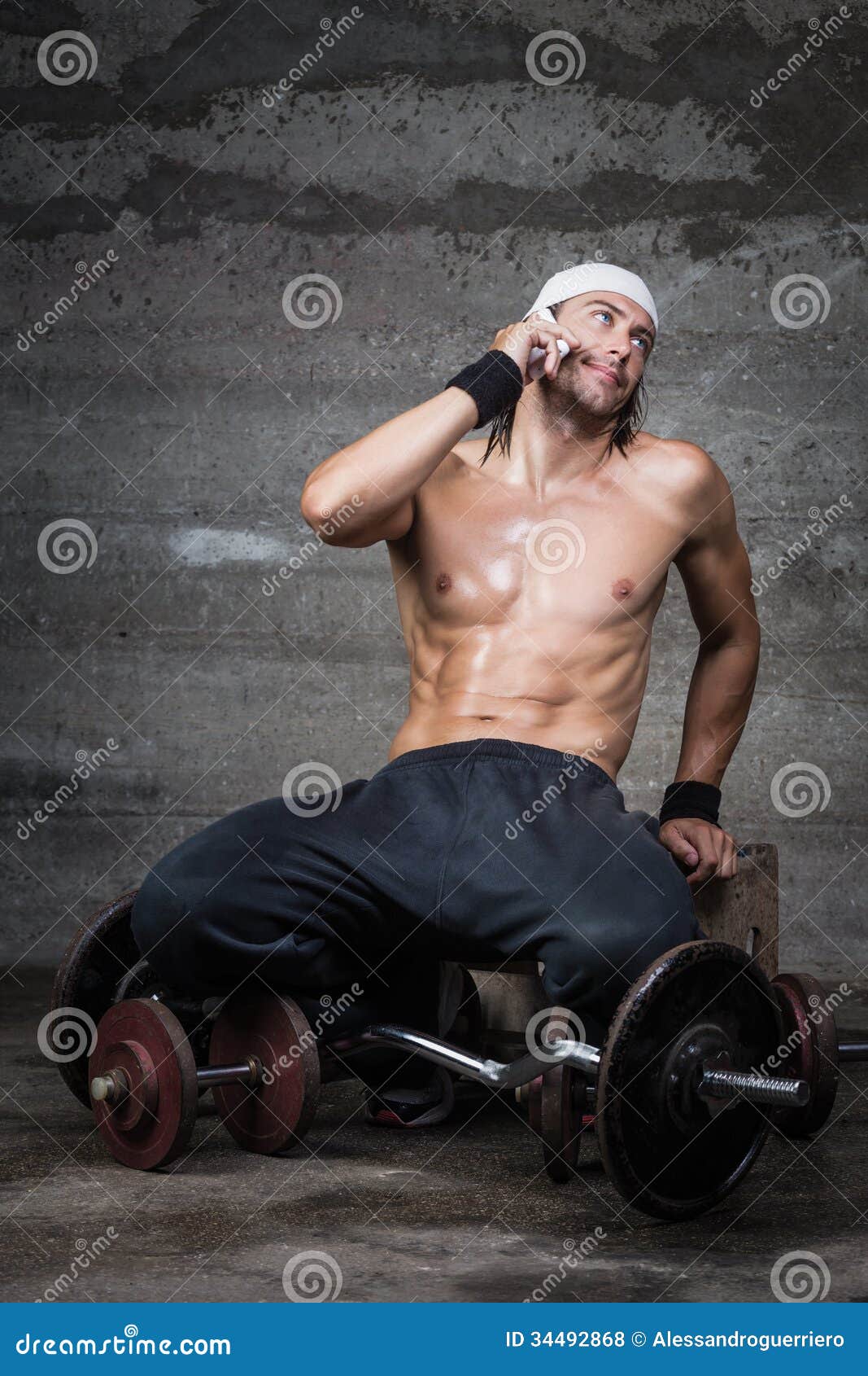 Handsome Bored Bodybuilder Talking On The Phone Stock Photo - Image of ...