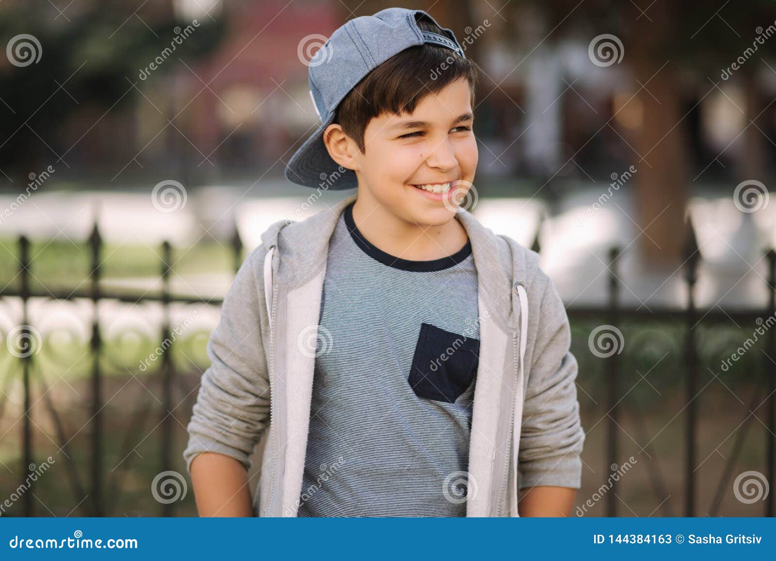 Handsome Boy in Cap Walking in the City Stock Image - Image of evening ...