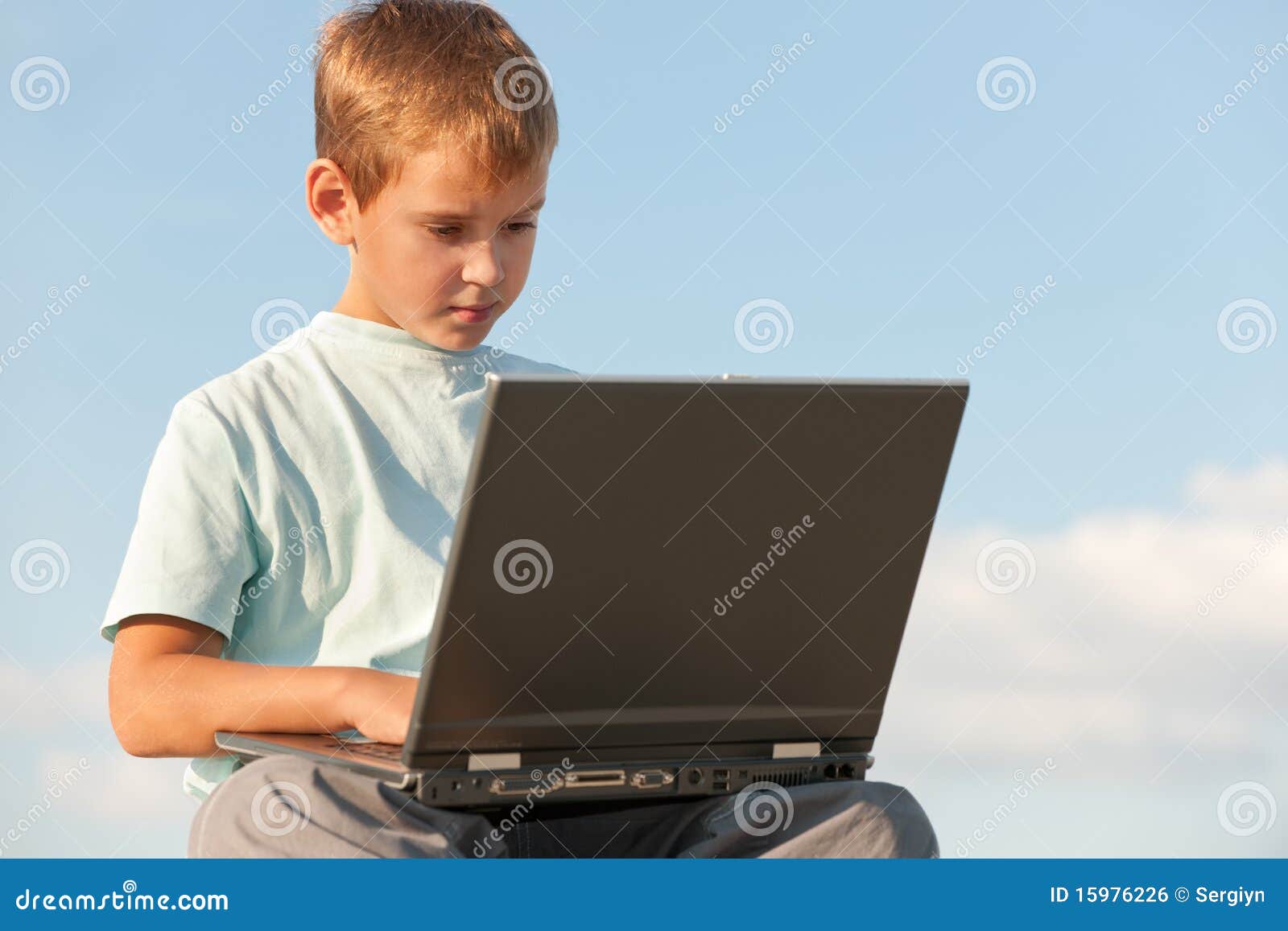 Handsome boy with laptop stock photo. Image of child - 15976226