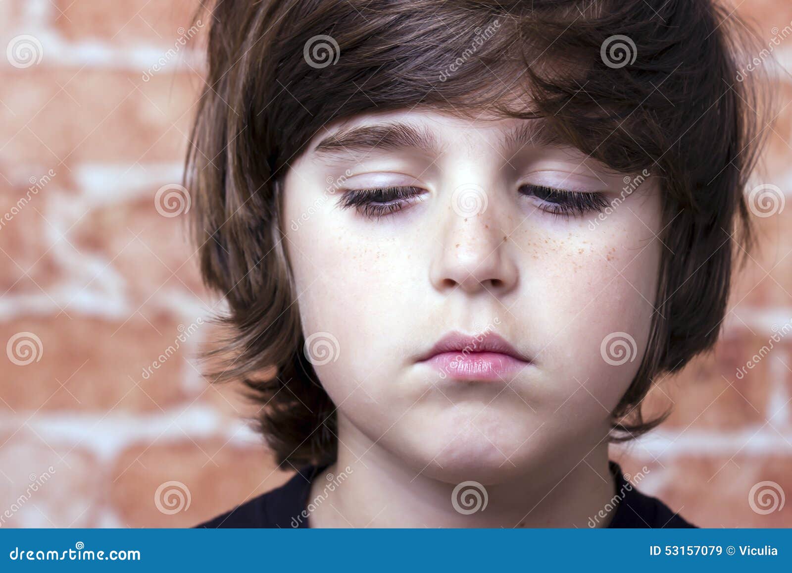 Handsome boy looking down stock image. Image of person - 53157079