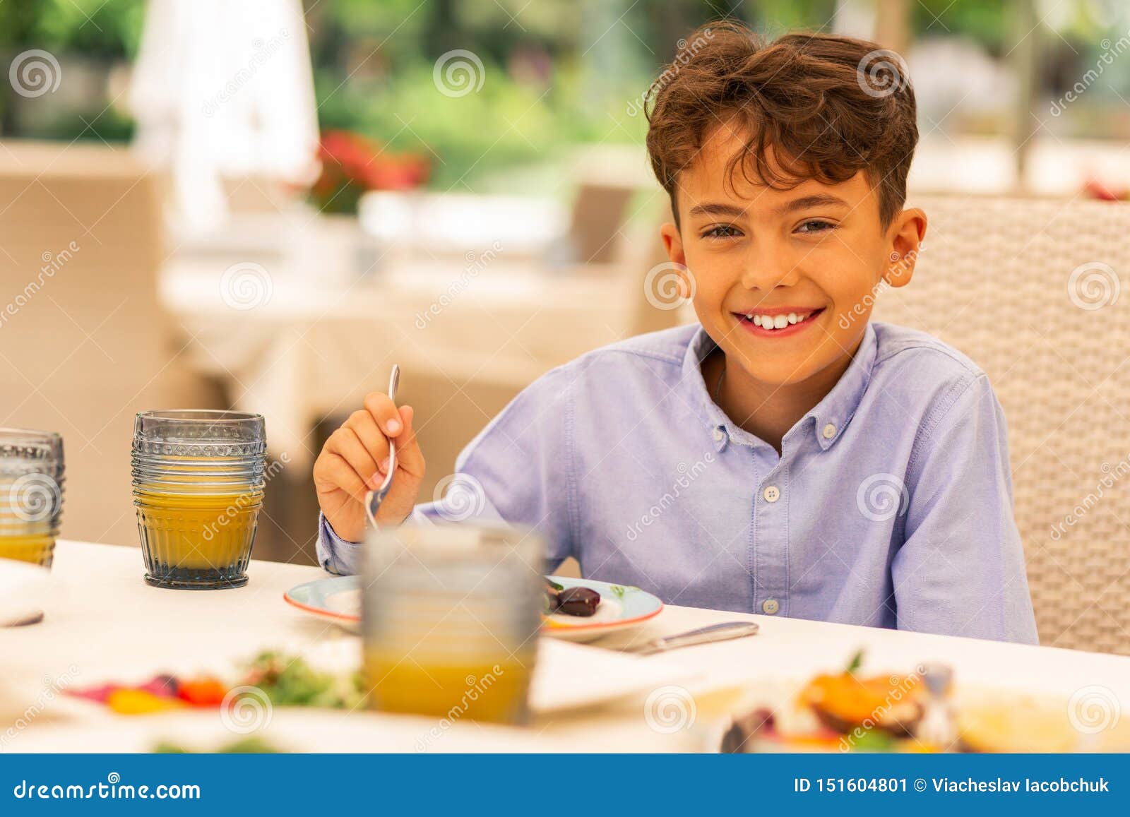 Handsome Boy Smiling while Enjoying Breakfast Stock Image - Image of ...