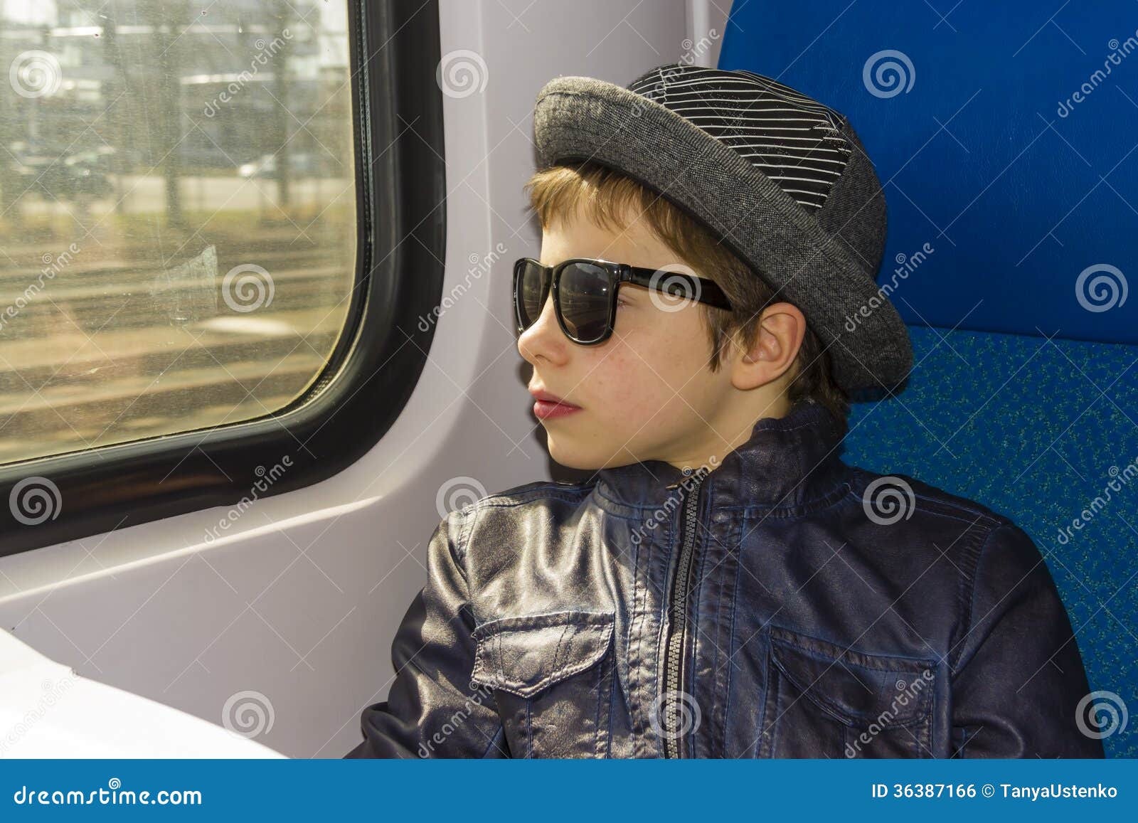 Handsome Boy in Sunglasses Rides on Train Stock Photo - Image of memory ...