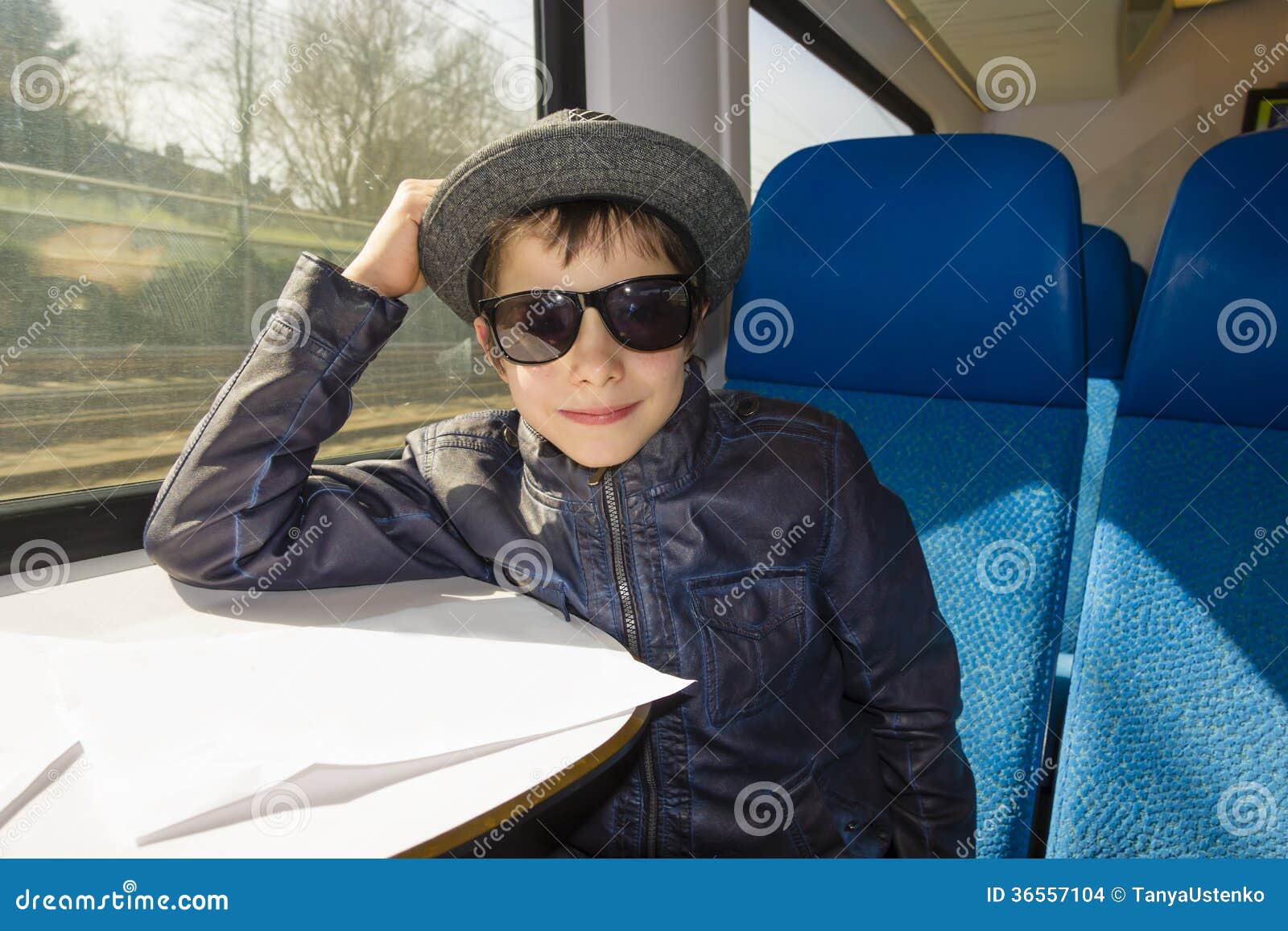 Handsome Boy in Sunglasses Rides on a Train Stock Photo - Image of ...