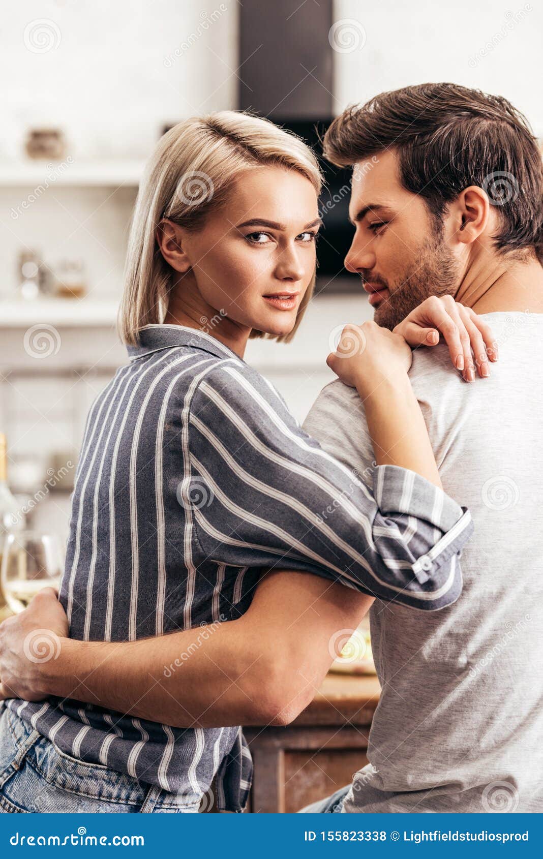 Handsome Boyfriend and Attractive Girlfriend Hugging and Looking Stock ...