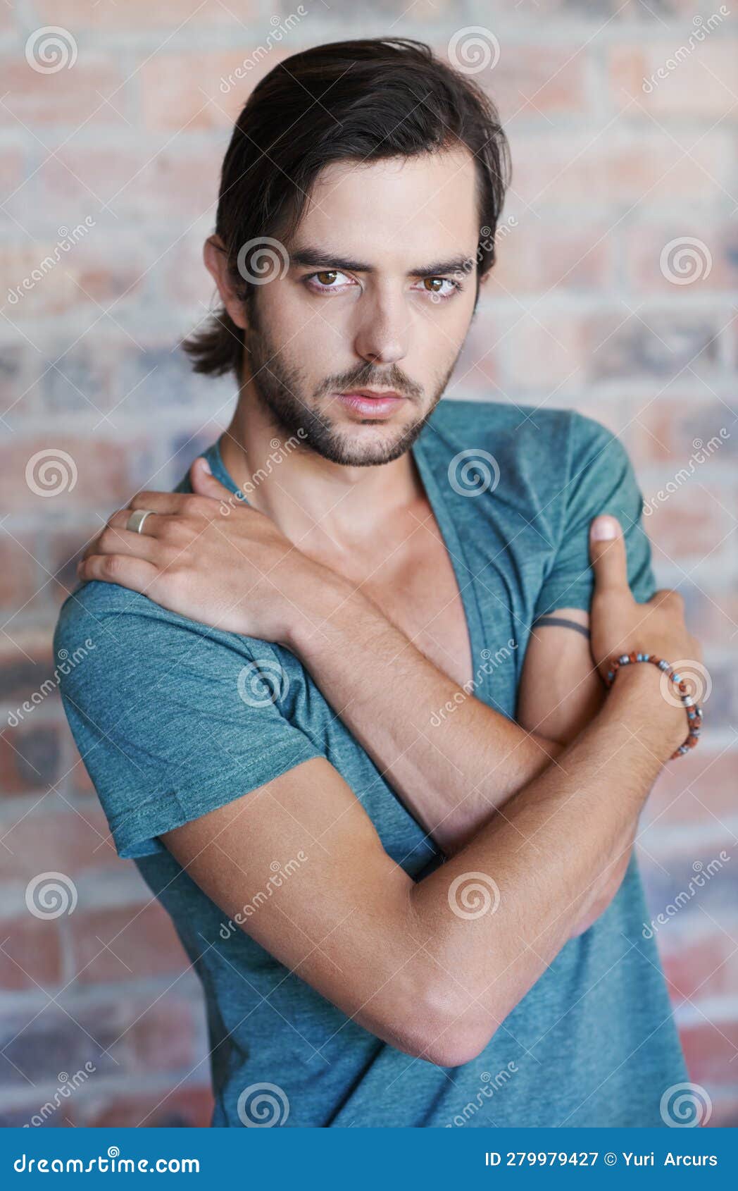 Handsome and Brooding. Portrait of a Brooding Man Standing Against a ...