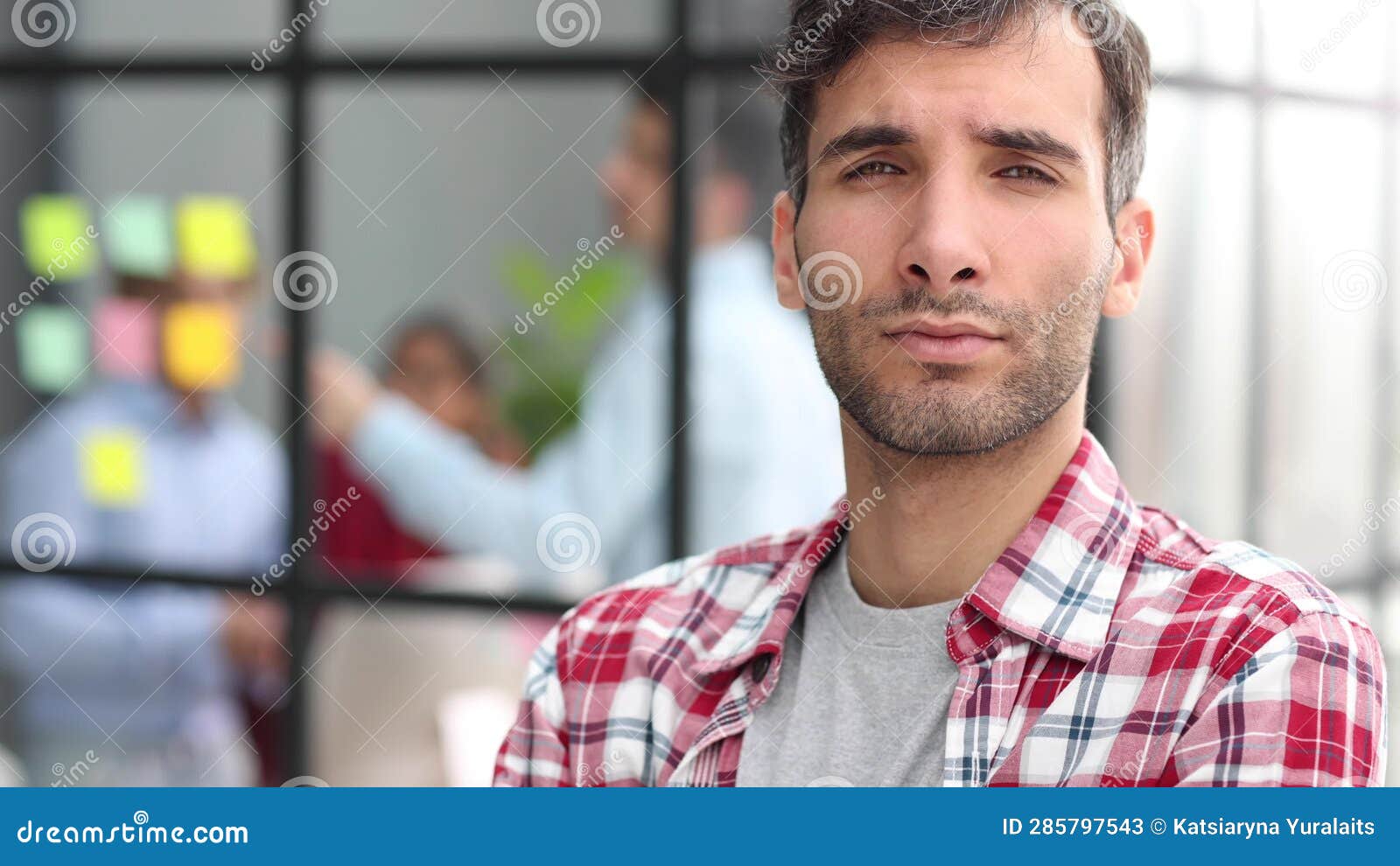 Handsome Brunette Guy Pose Alone At Workplace Or Loft Apartment Look At