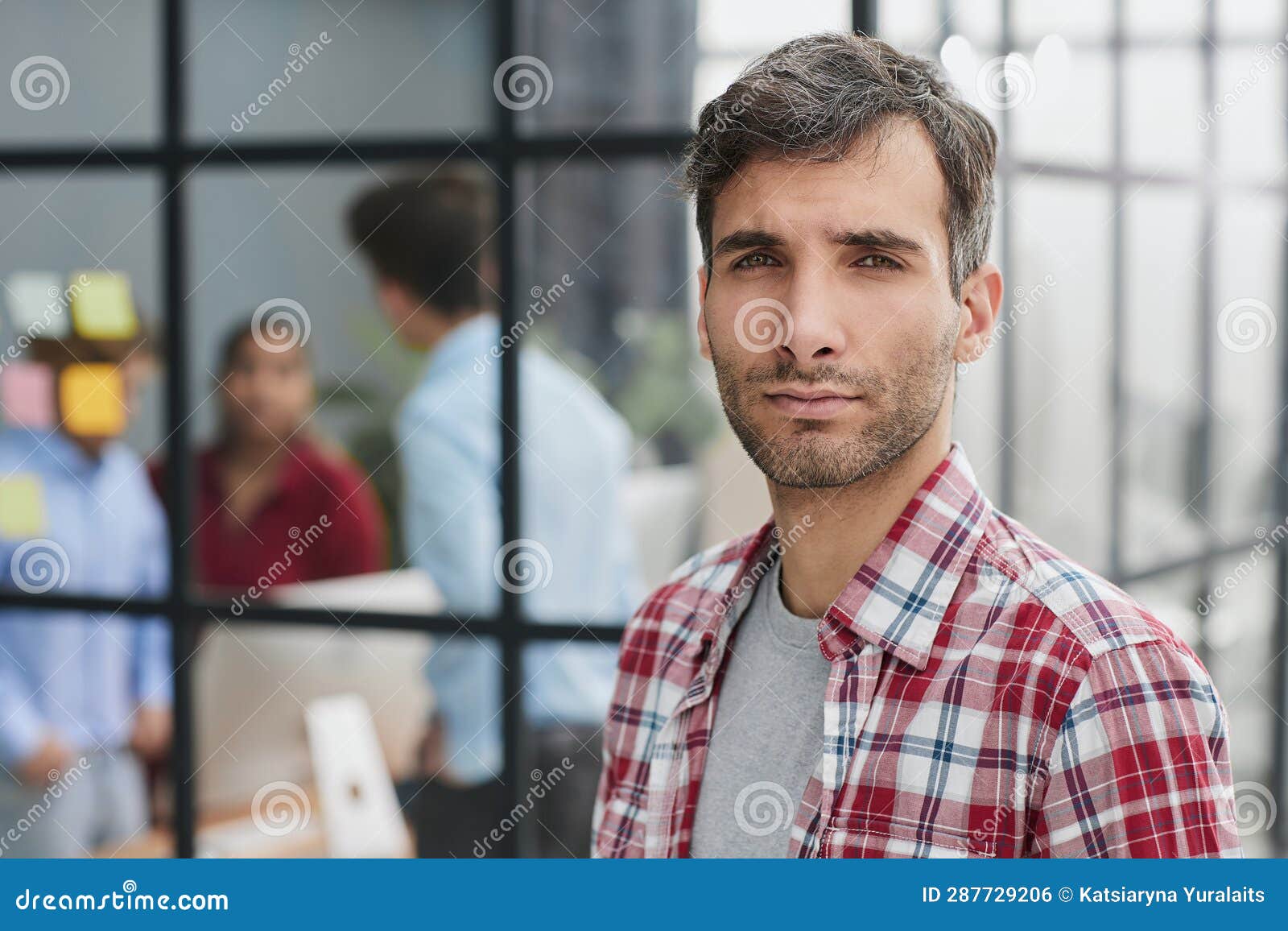 Handsome Brunette Guy Pose Alone At Workplace Or Loft Apartment Look At