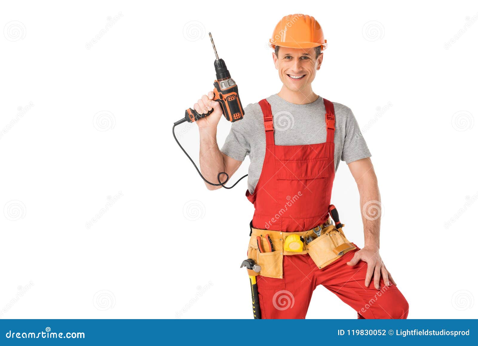 Handsome Builder in Uniform with Tool Belt Holding Drill Stock Photo ...