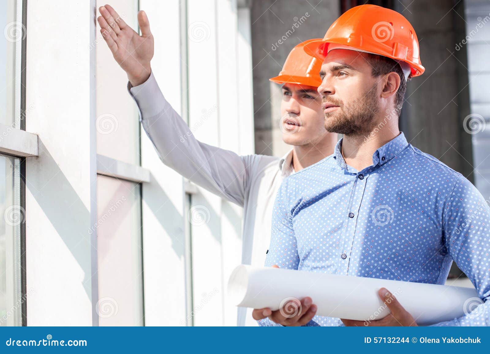 Handsome Builders are Discussing the Plan of Work Stock Photo - Image ...